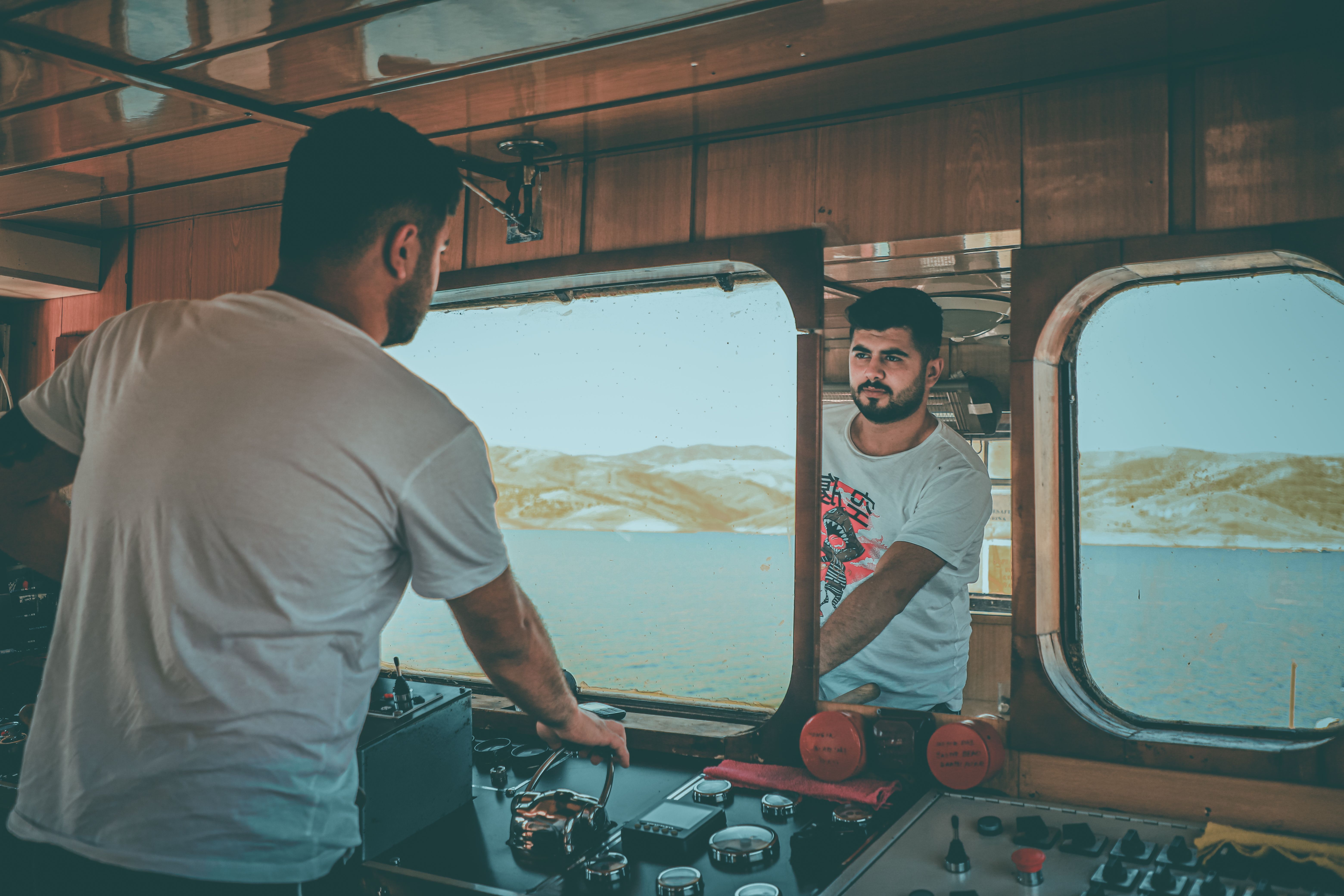 Man Piloting a Motorboat · Free Stock Photo