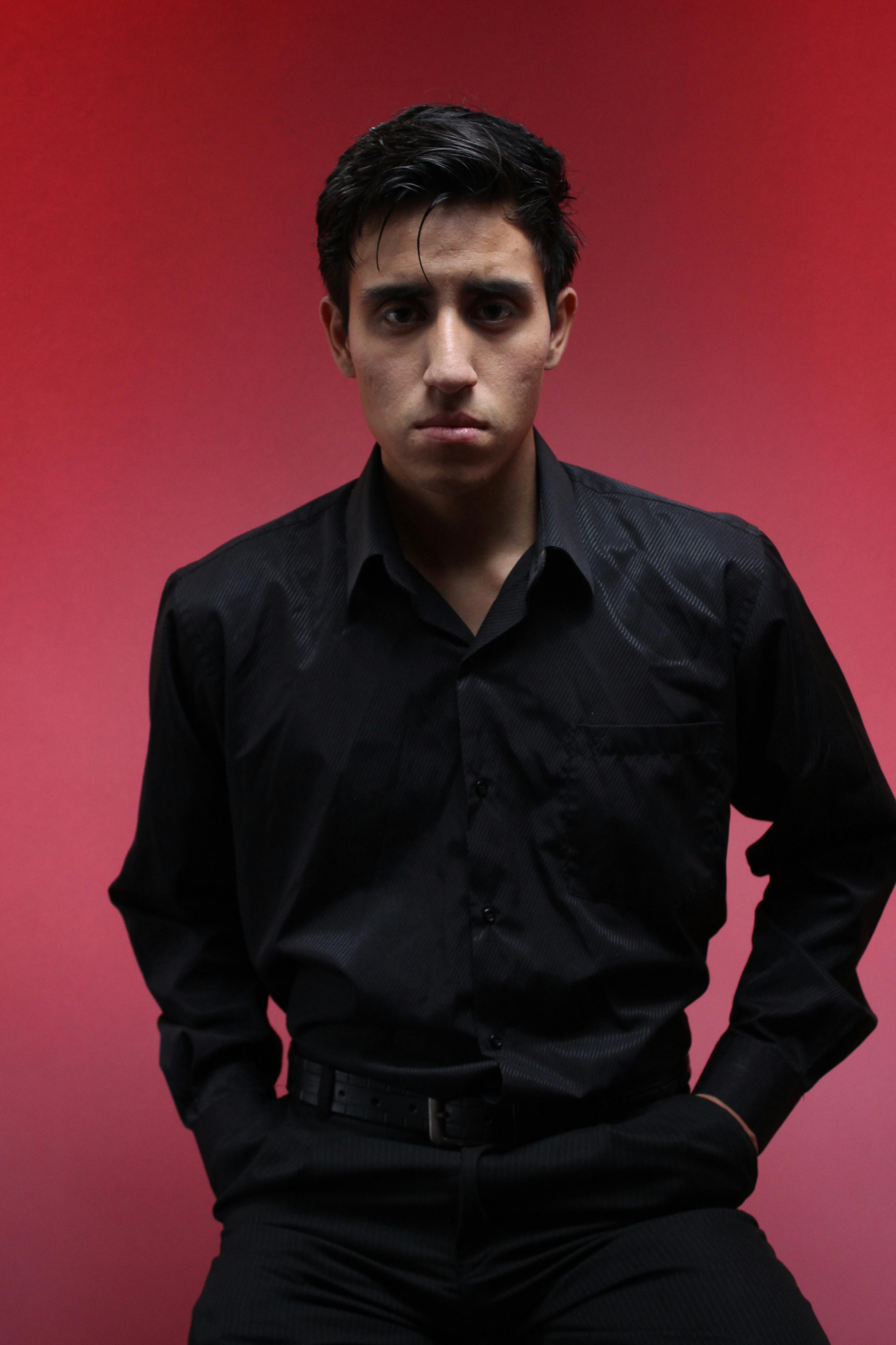 Man in Black Shirt in Red Background · Free Stock Photo