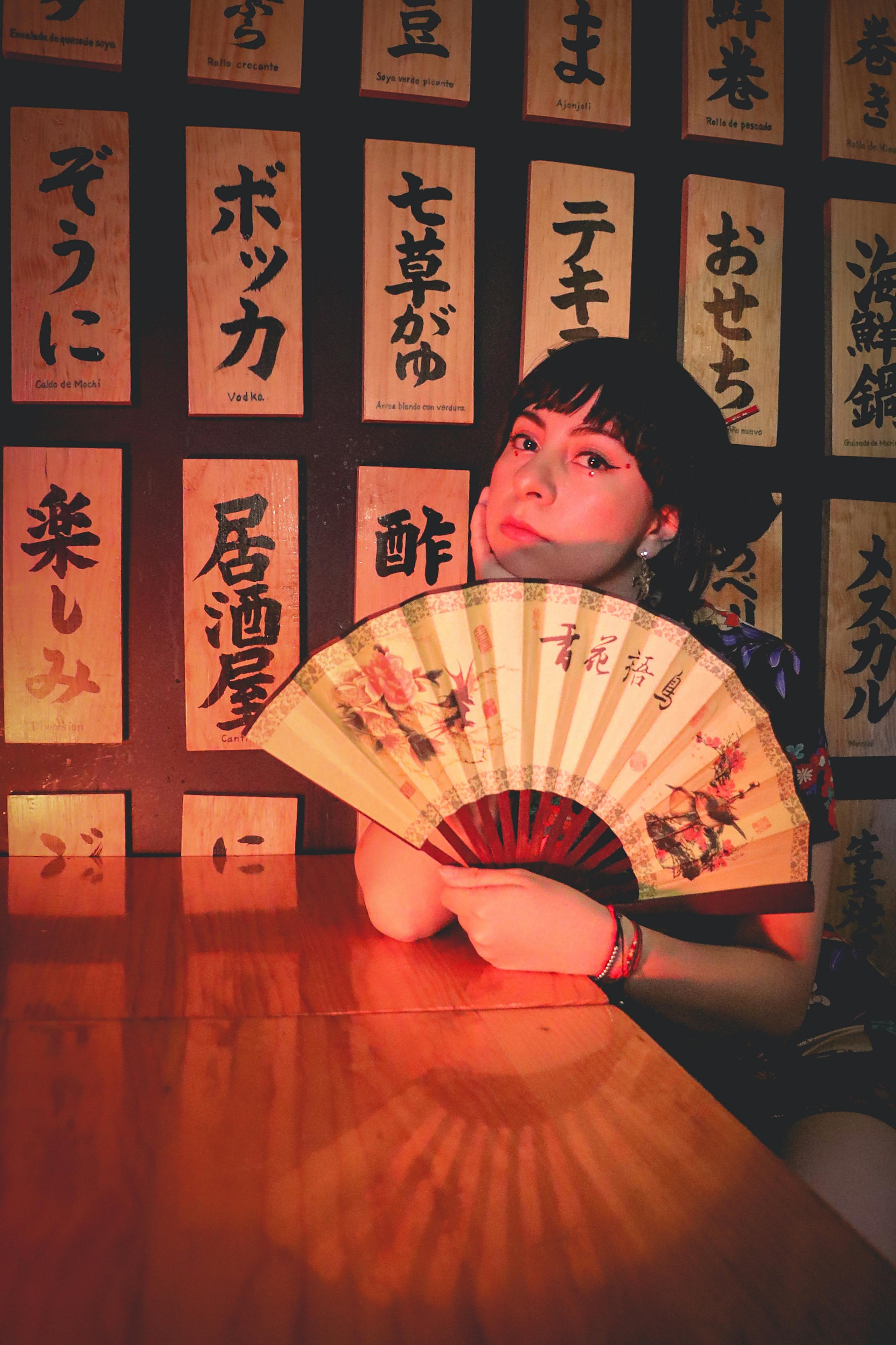 Woman with Traditional Japanese Fan · Free Stock Photo