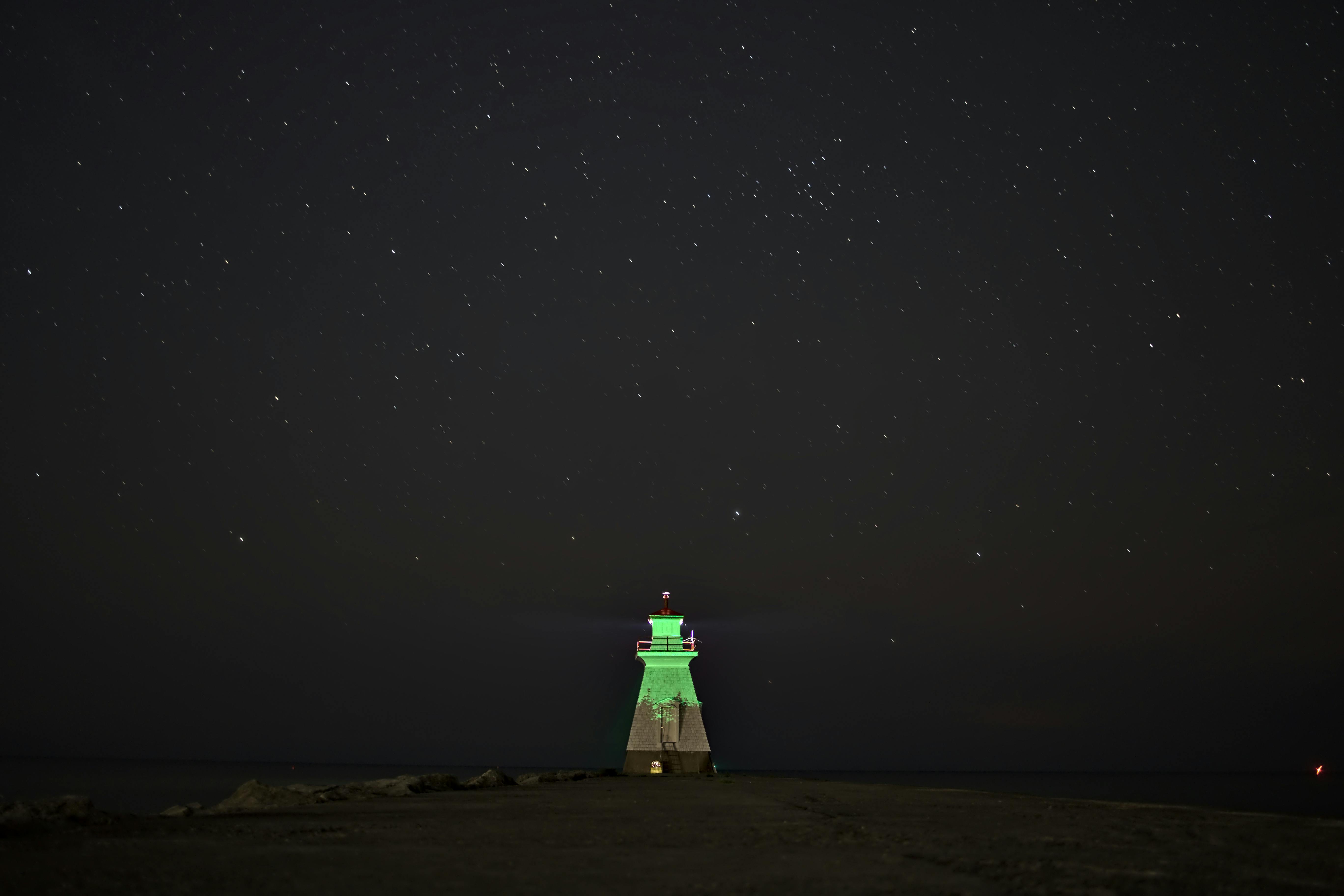 Green and Gray Lighthouse at Night · Free Stock Photo