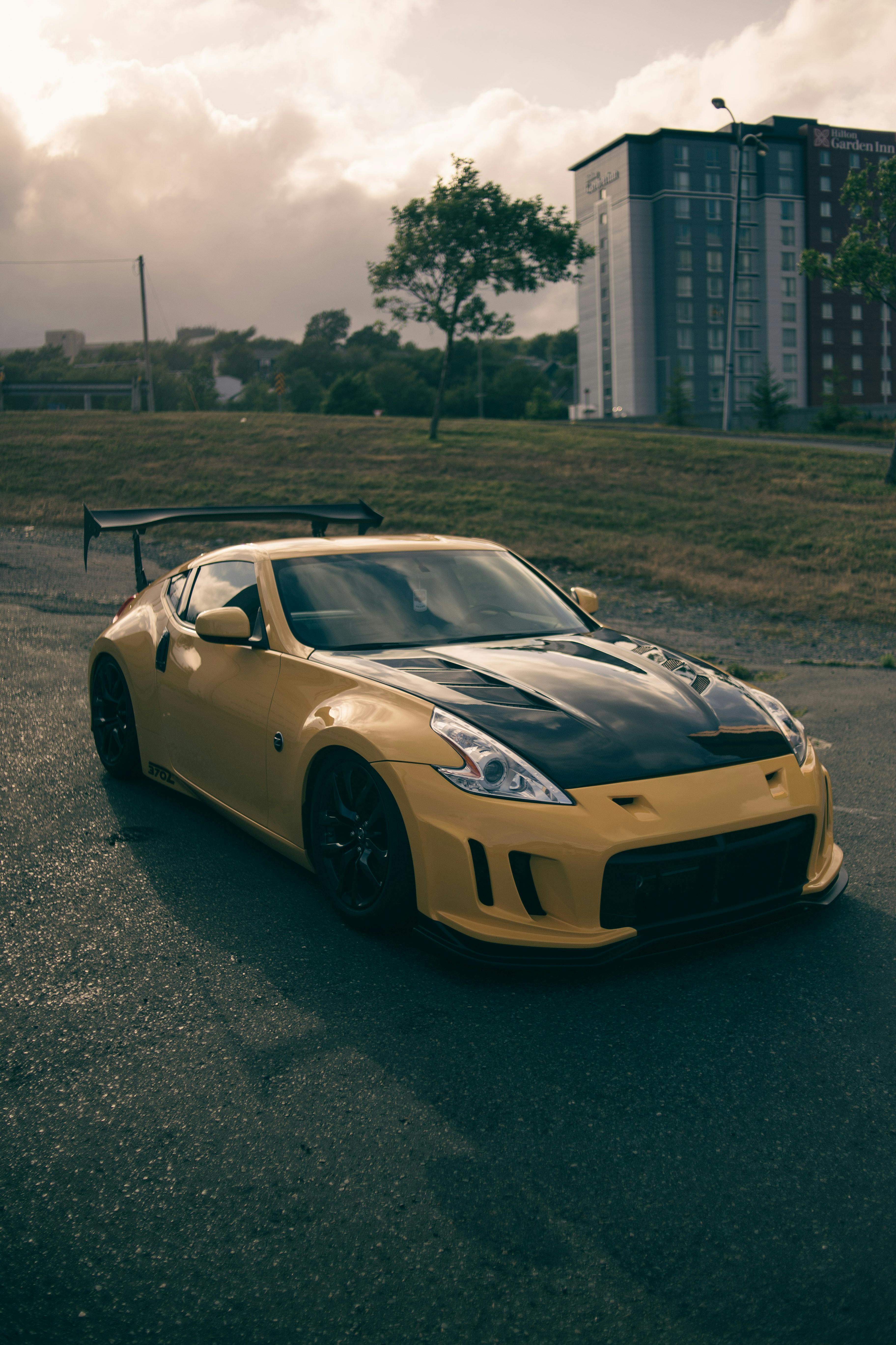 Yellow Sportscar on Asphalt Road · Free Stock Photo