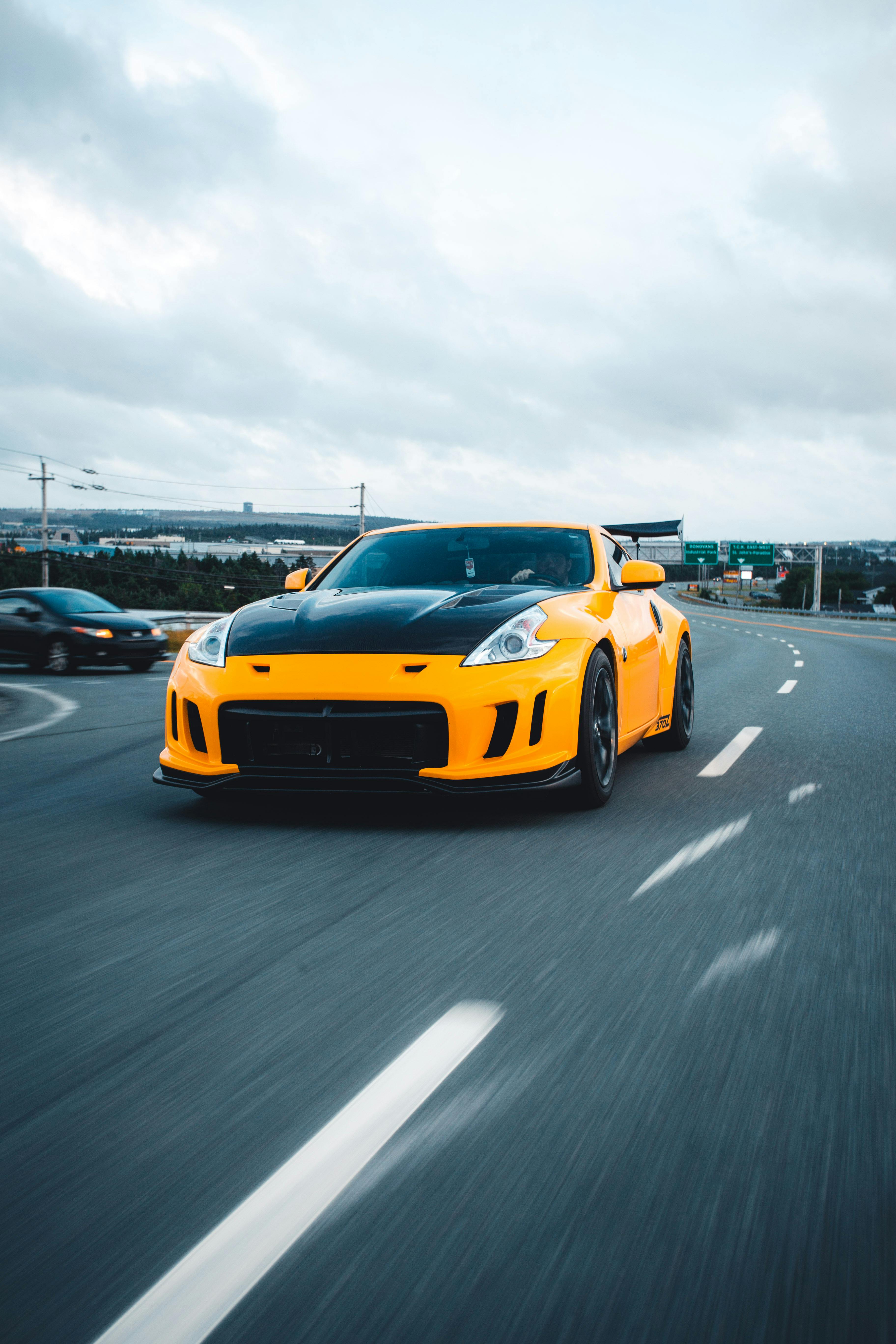 Car Driving On The Road Towards Mountains · Free Stock Photo