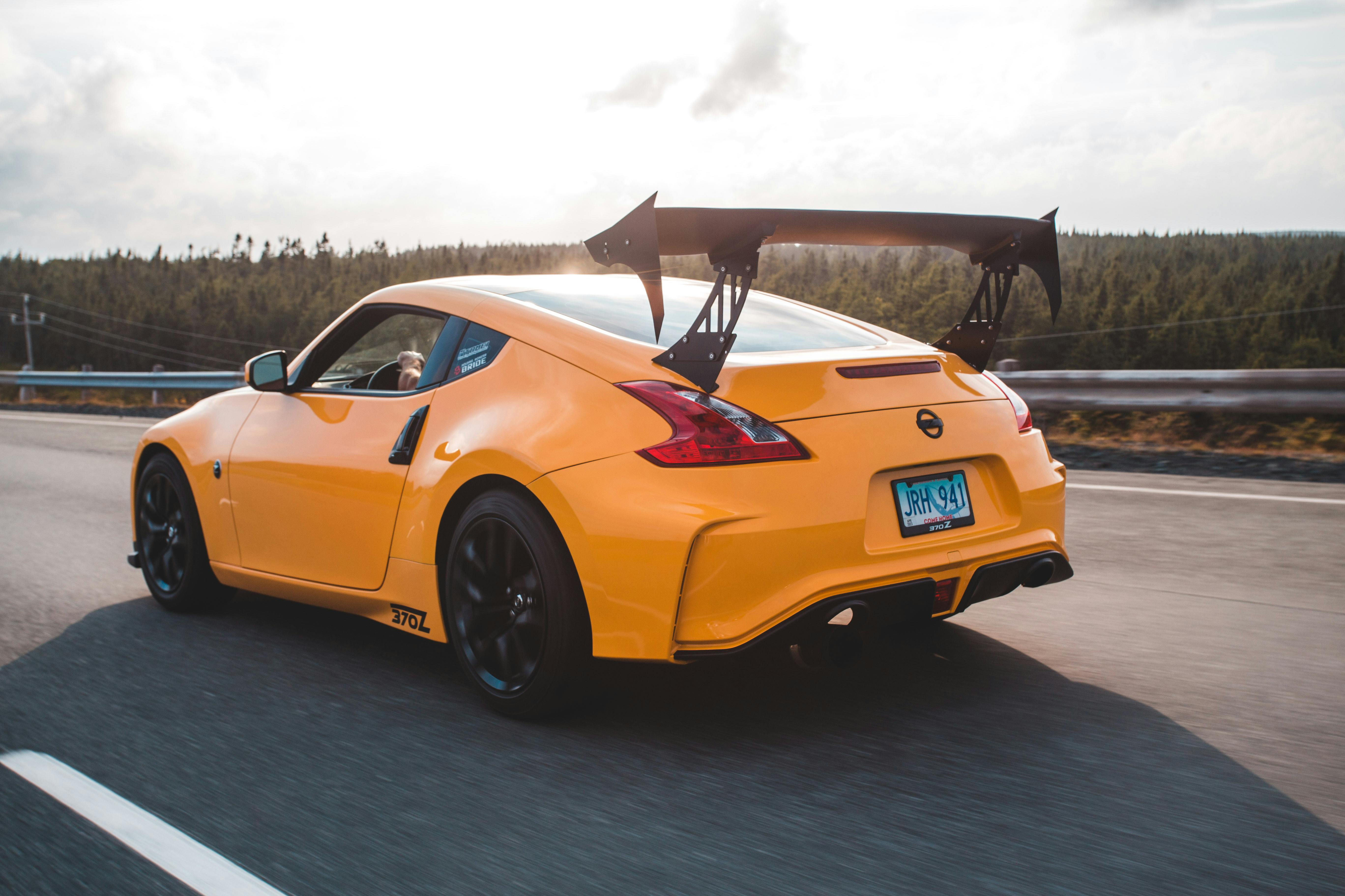 A Car Driving on a Road · Free Stock Photo
