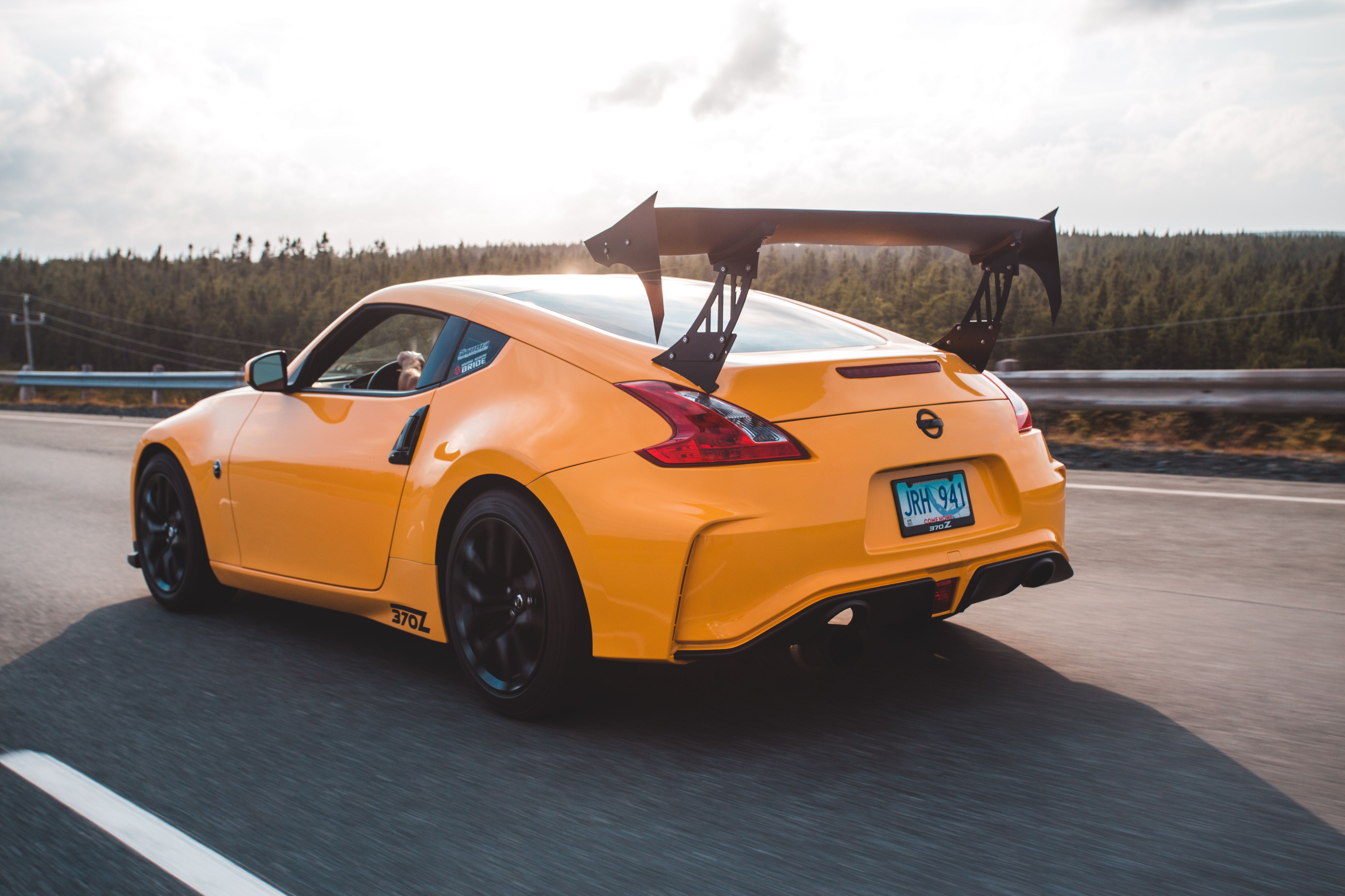 A Car Driving on a Road · Free Stock Photo