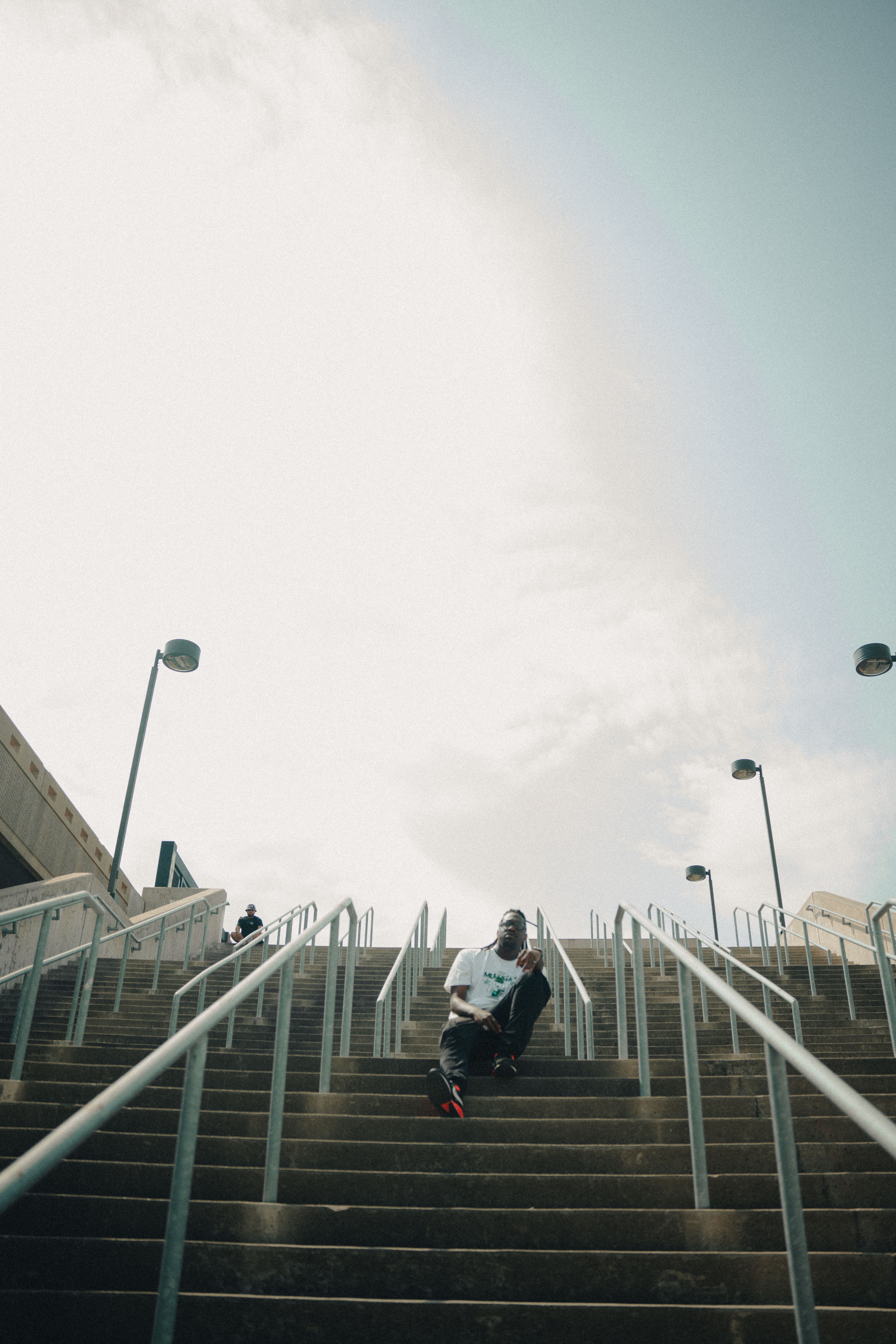 A Man Sitting on Stairs · Free Stock Photo