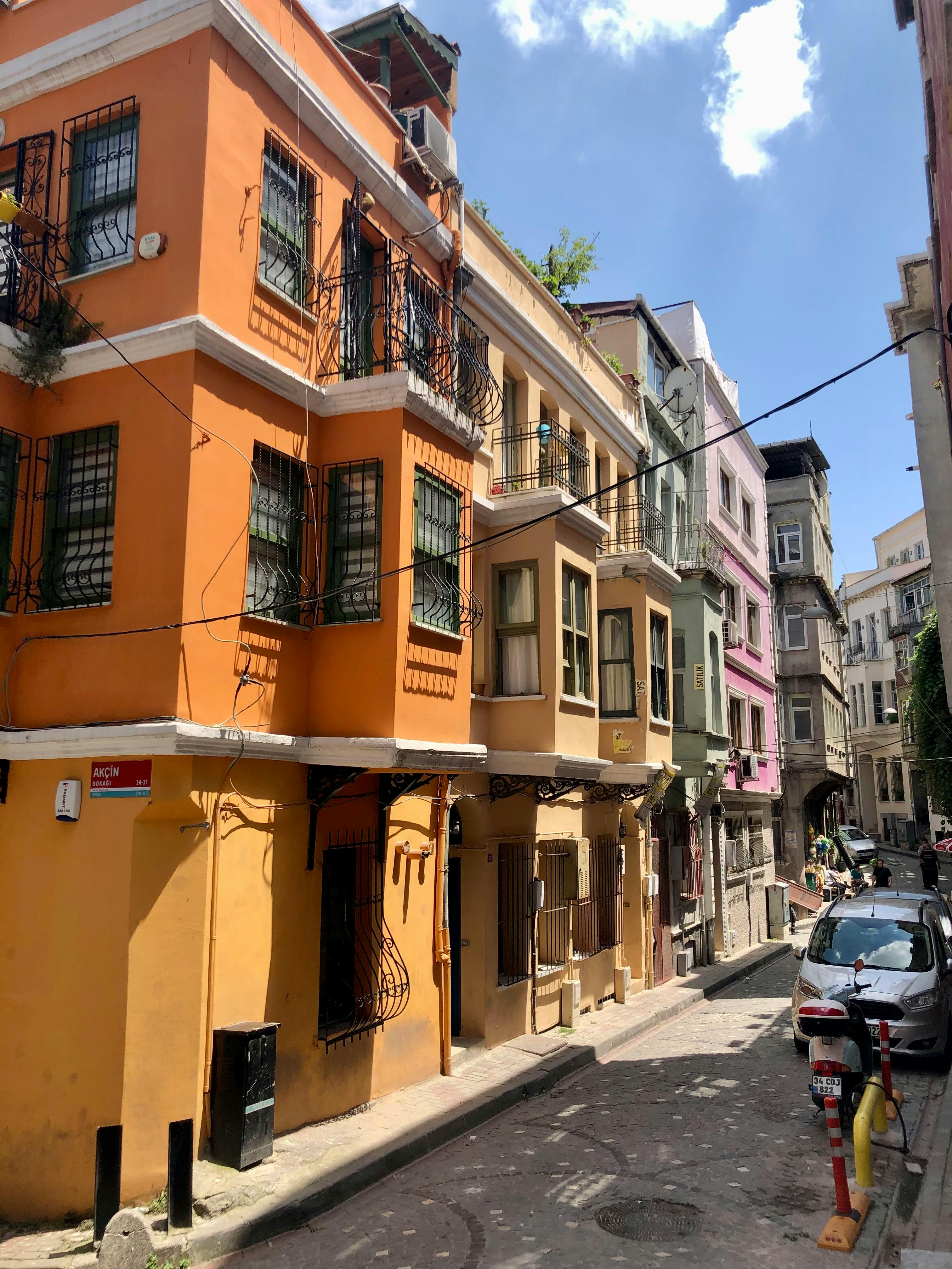 A Street with a Concrete Road and Shabby Walls · Free Stock Photo