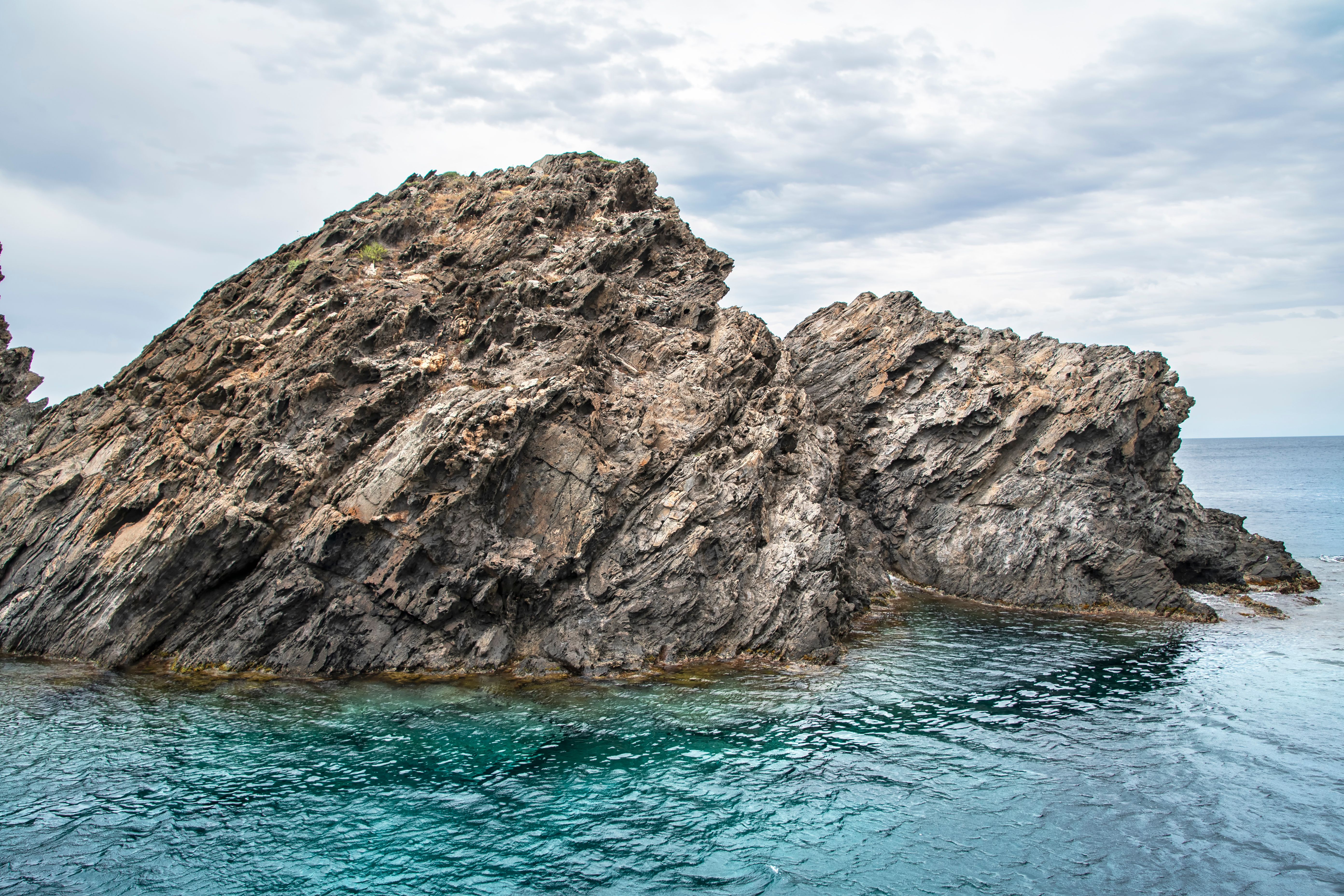 A Rock Formation on the Sea · Free Stock Photo