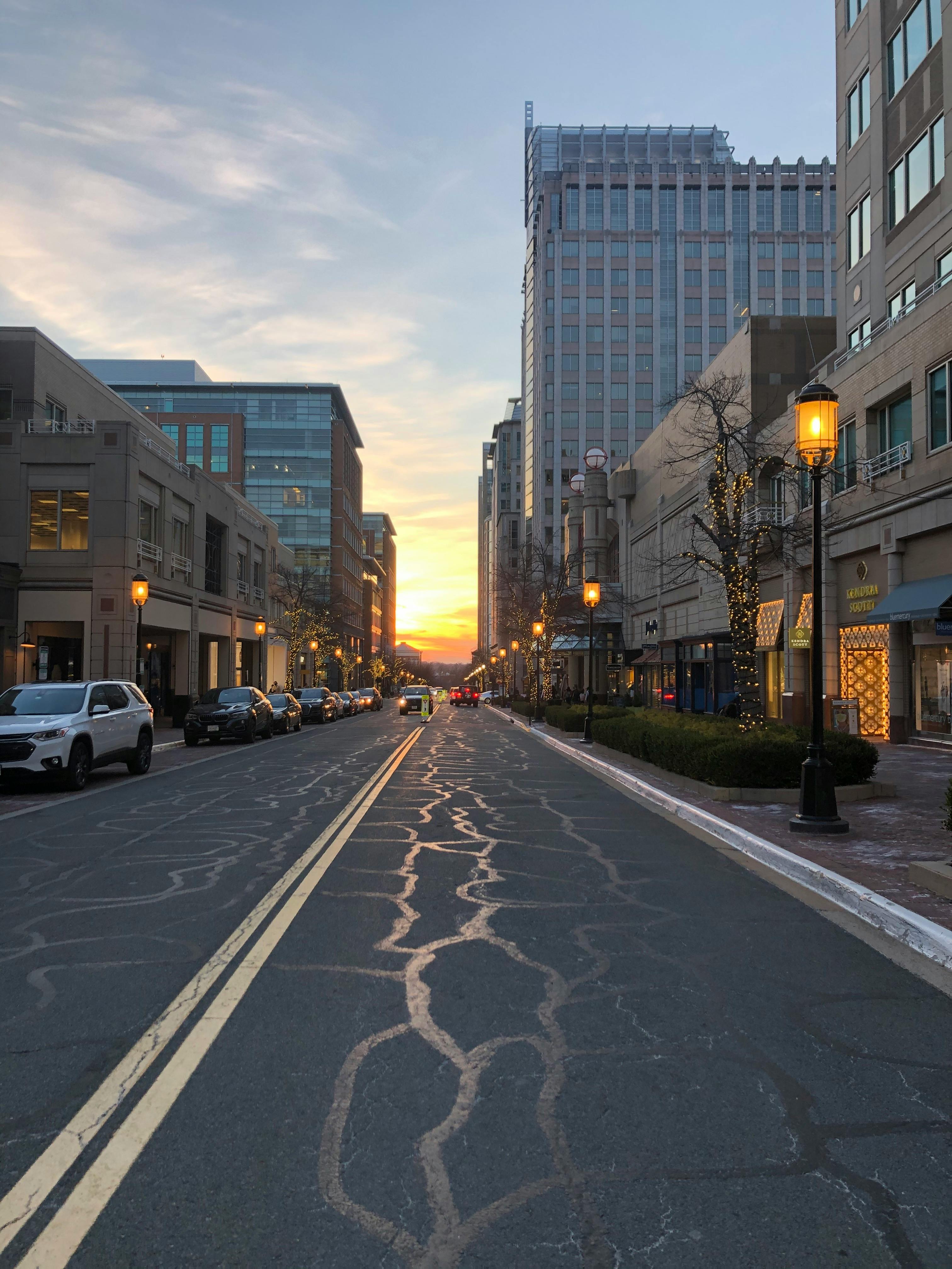 A Cars Parked on the Street Between Buildings · Free Stock Photo