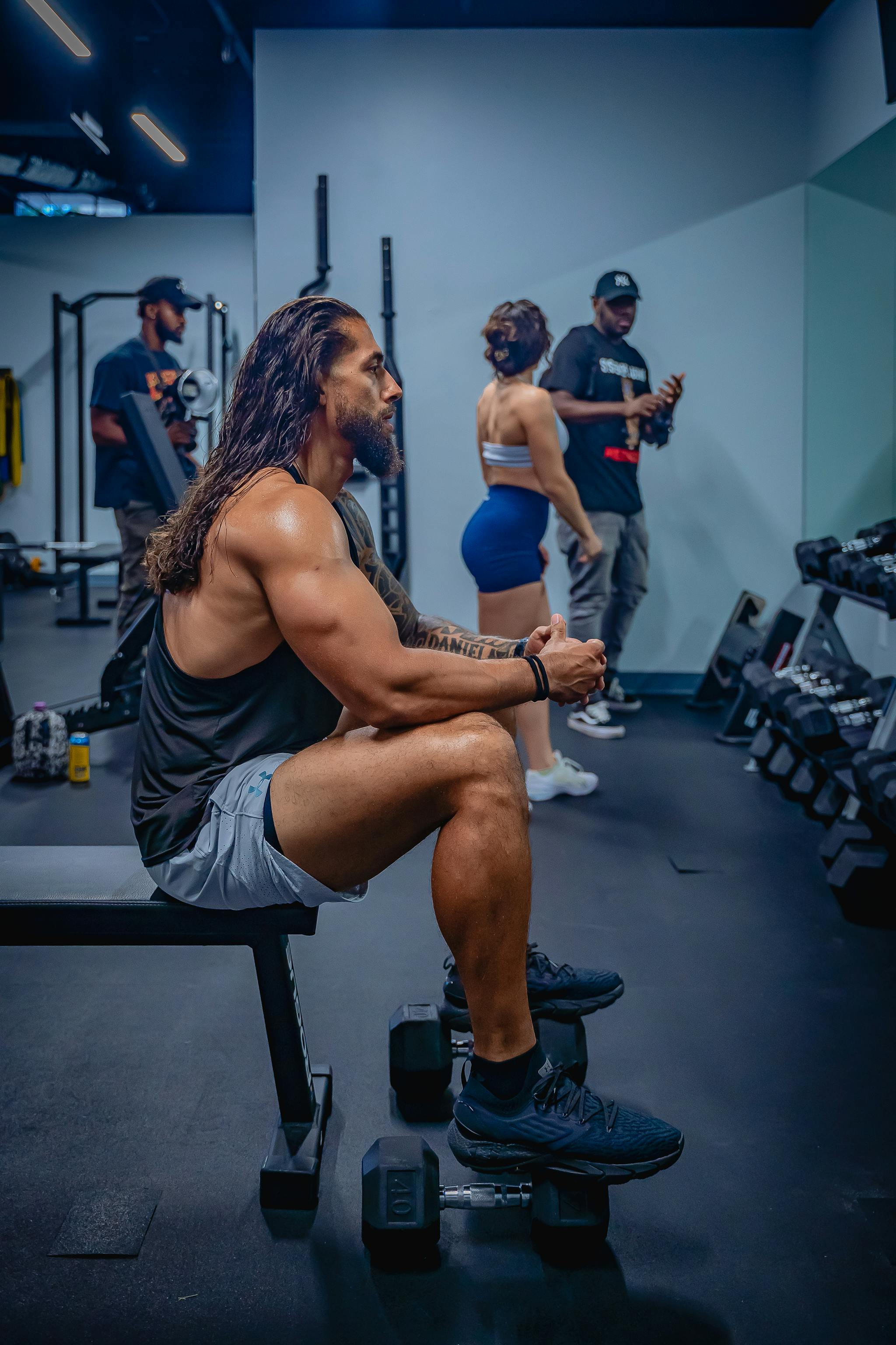 Side View of a Muscular Man Training in a Gym · Free Stock Photo