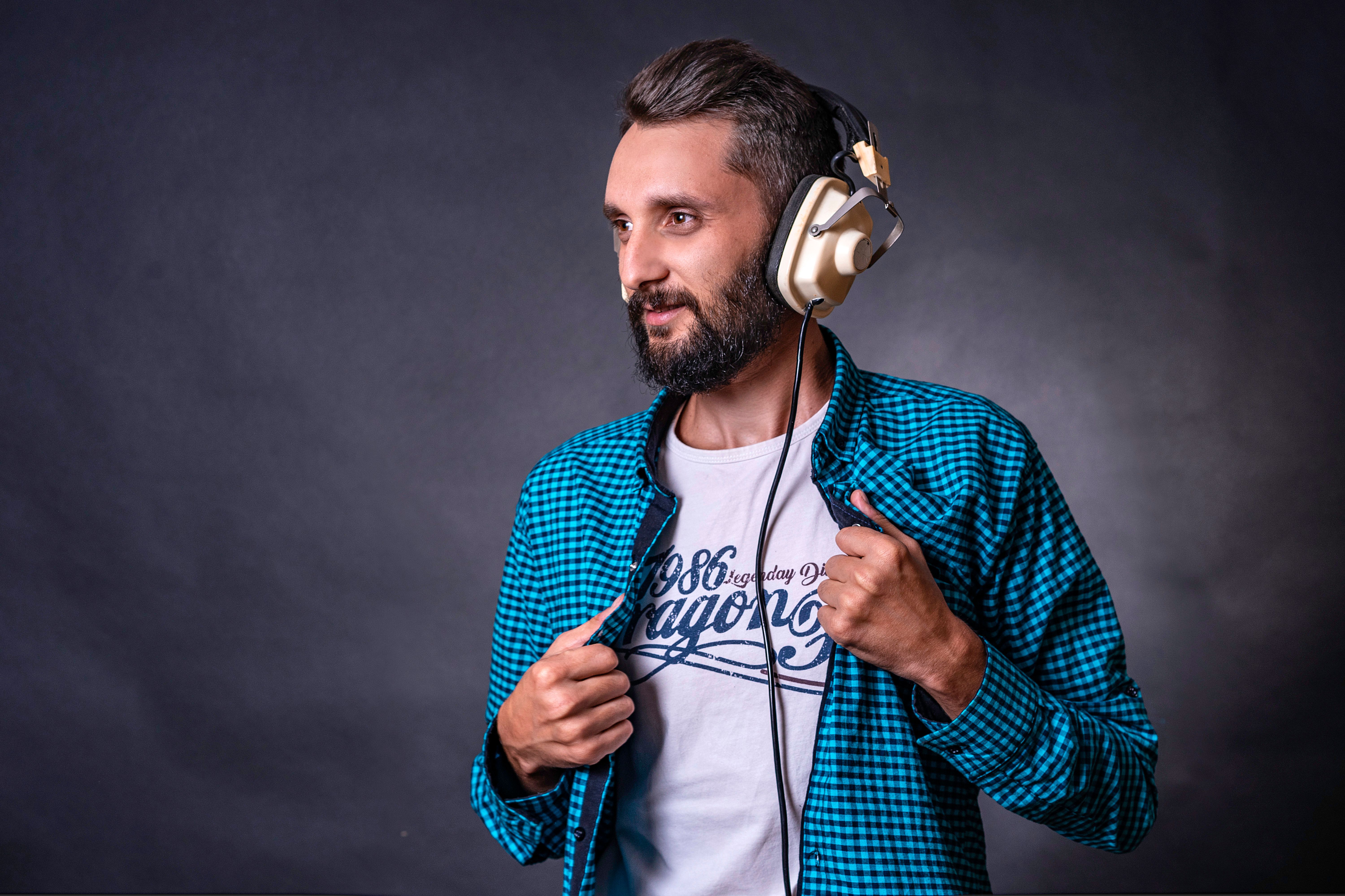 Funky Man with Headphones Making Hearing Gesture · Free Stock Photo