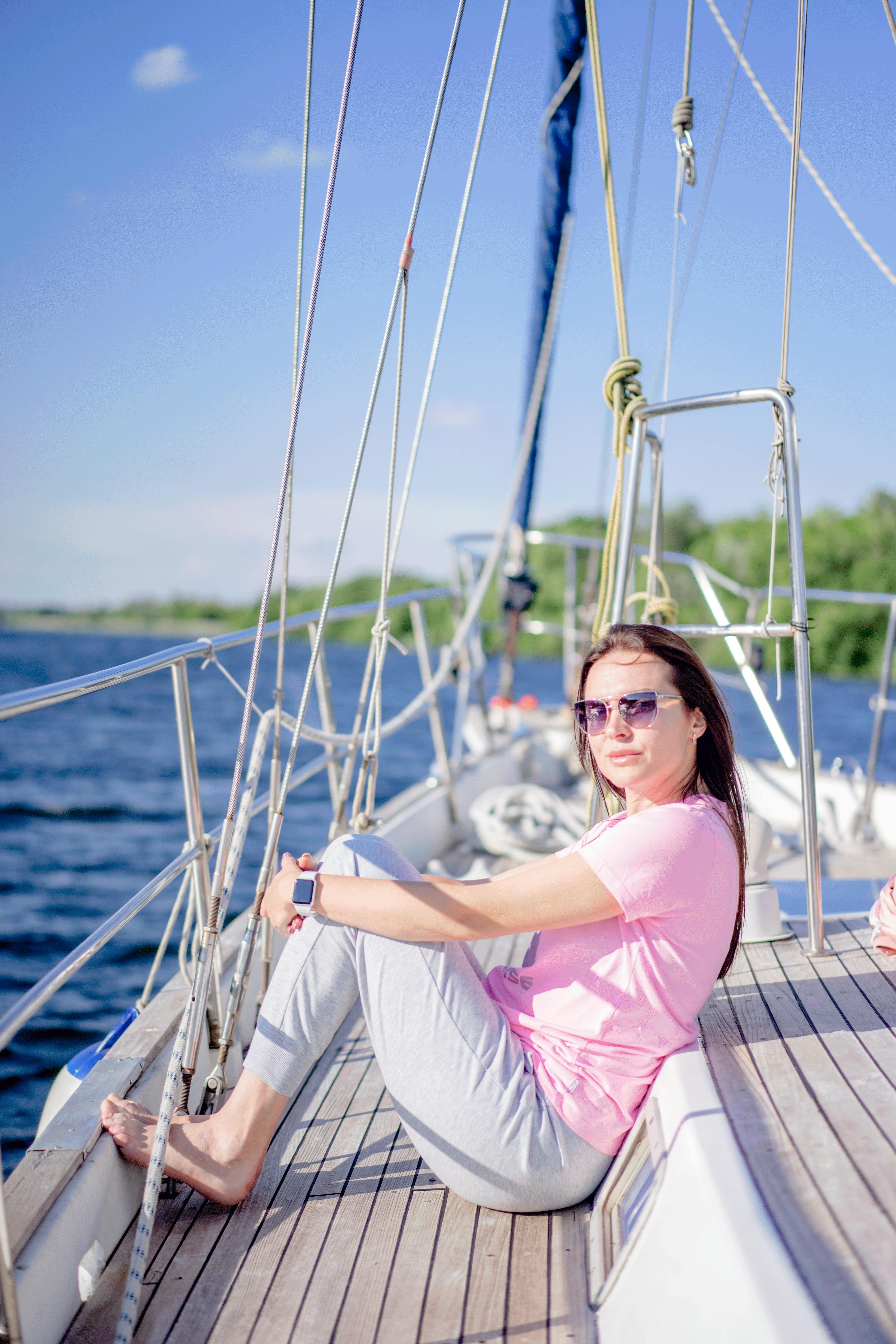 Back View of a Young Woman Sitting in a Boat · Free Stock Photo