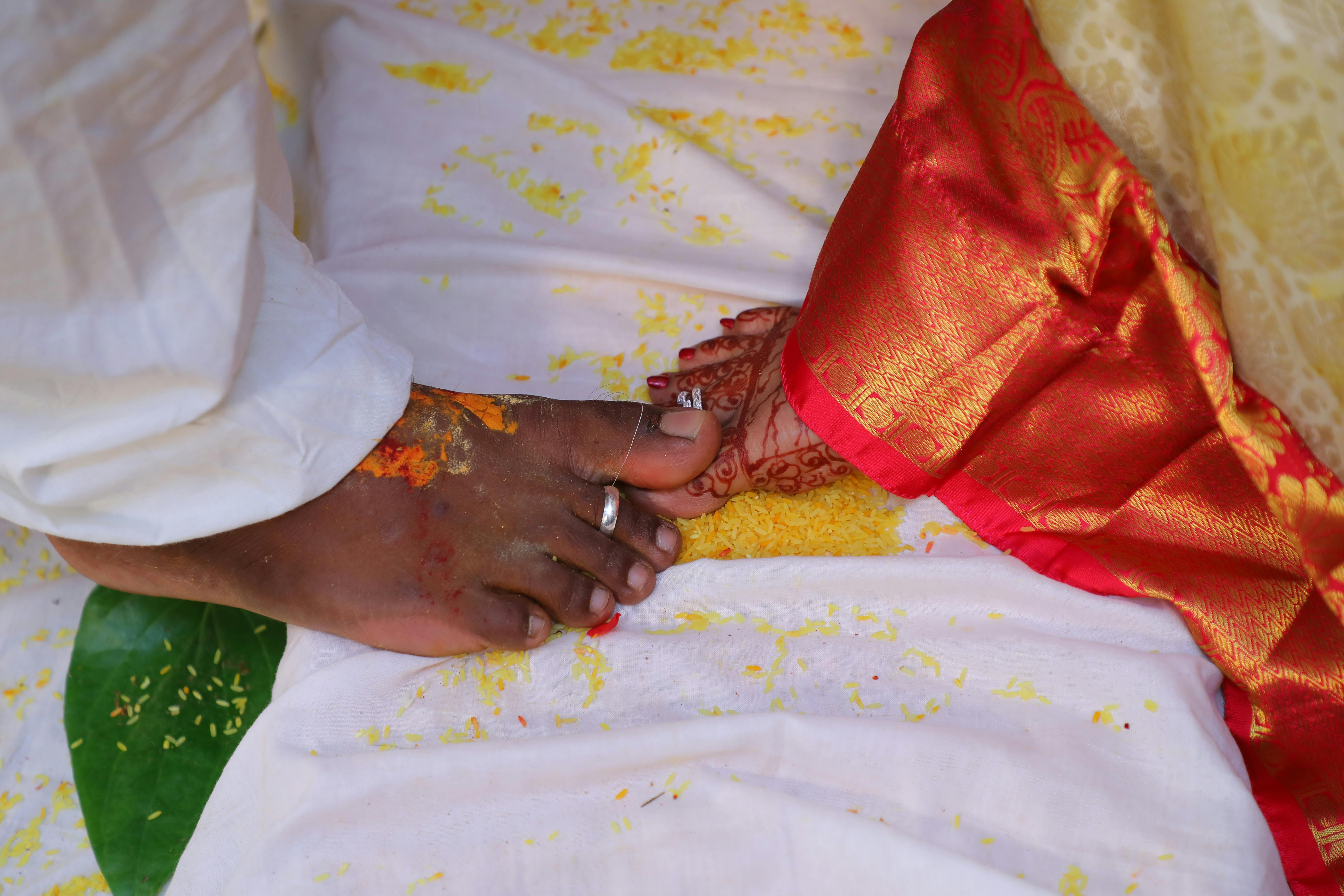 Man and Woman Feet During Traditional Ceremony · Free Stock Photo