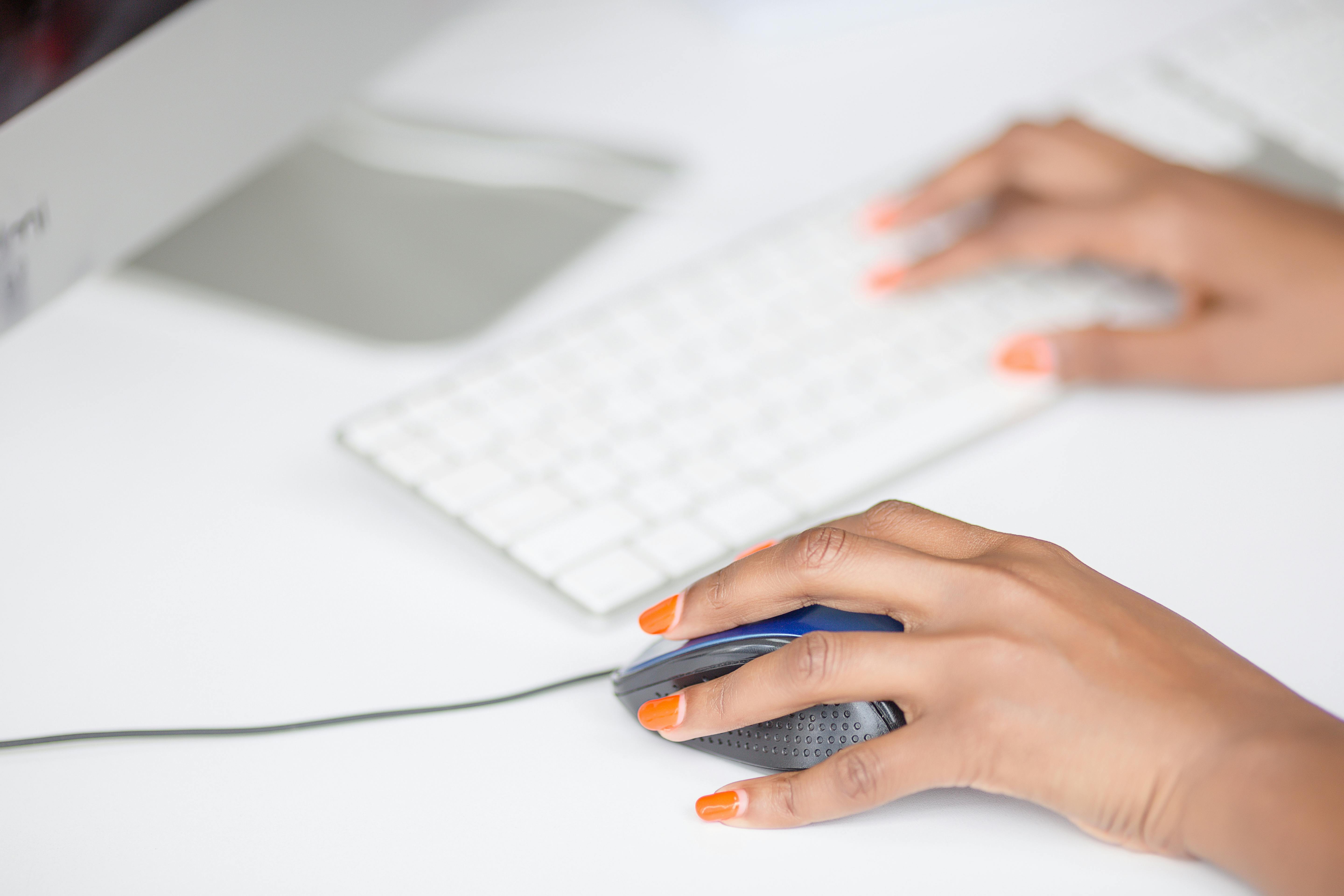 Person Holding Black Cordless Computer Mouse · Free Stock Photo