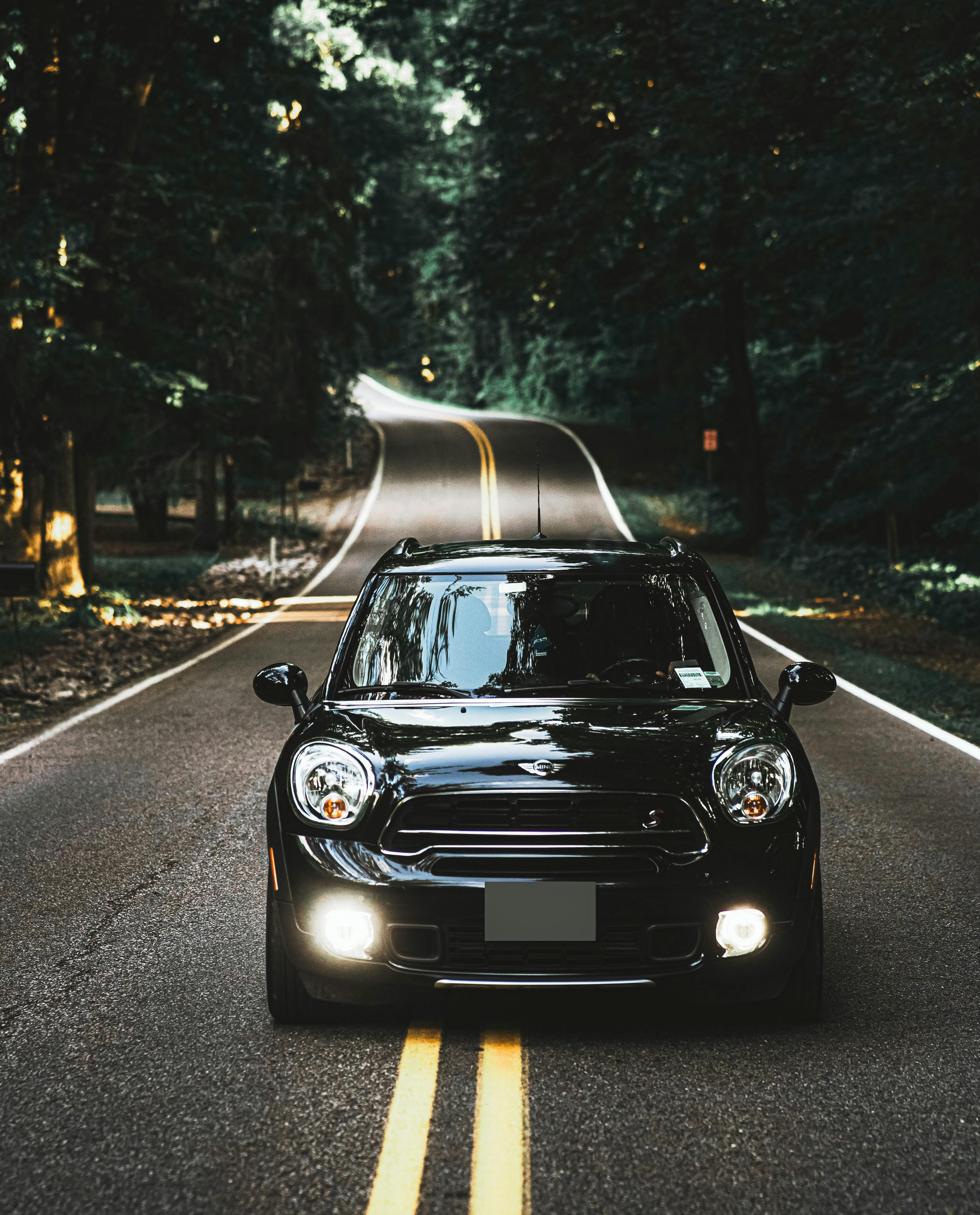 Gray Car in the Middle of Highway Near Green Trees · Free Stock Photo
