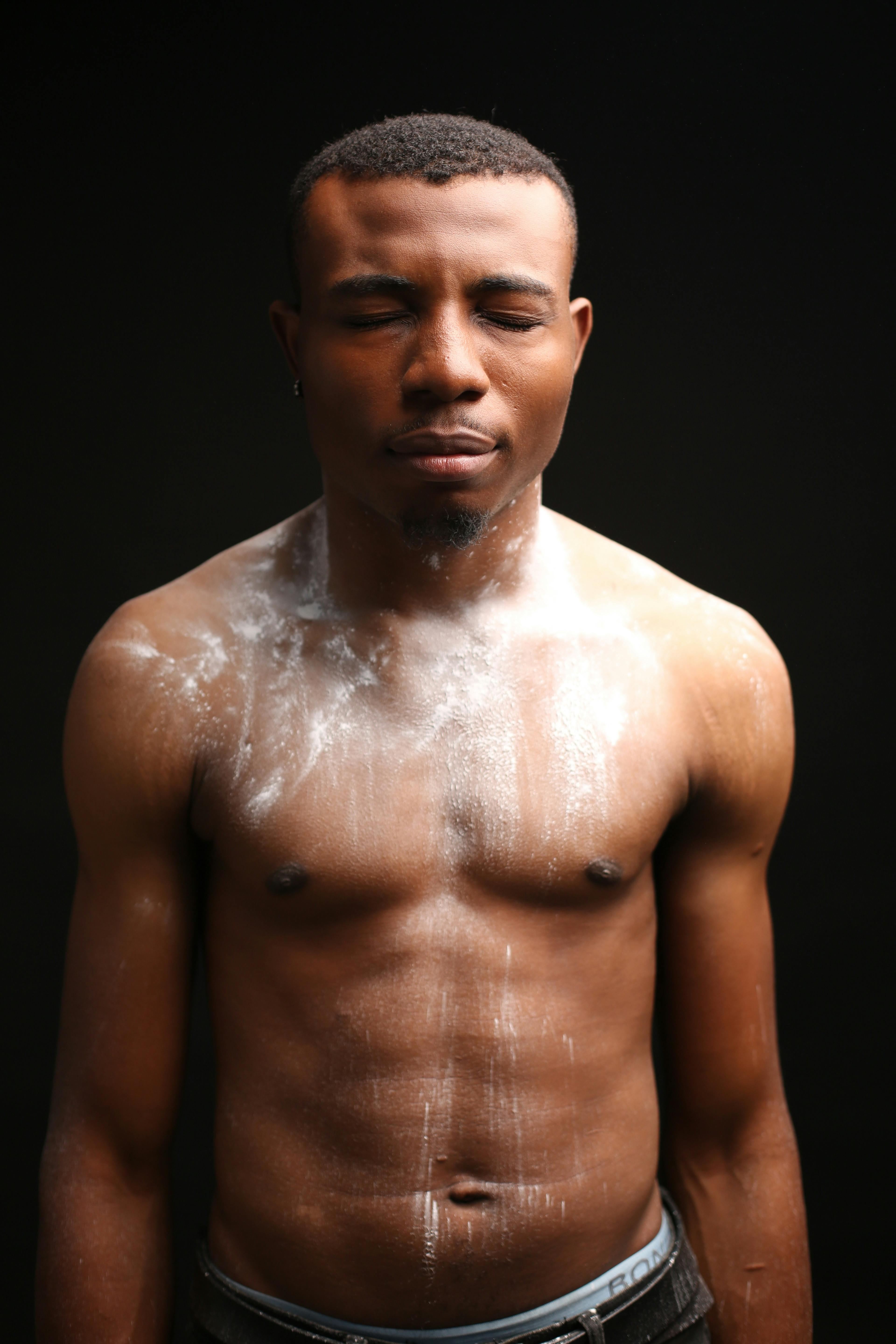 Shirtless Man with White Powder on His Body · Free Stock Photo