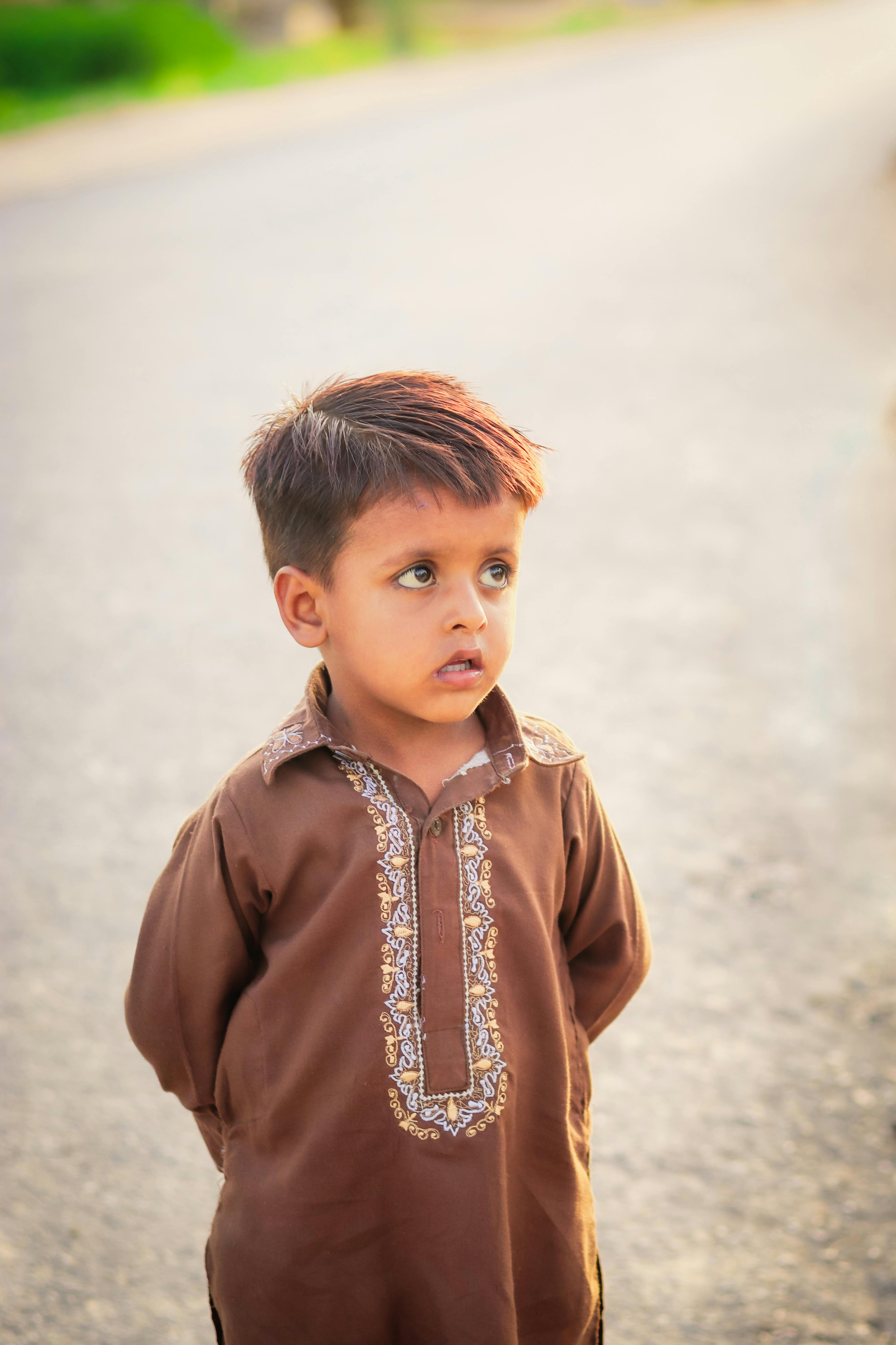 Portrait of a Little Boy in Traditional Clothing · Free Stock Photo
