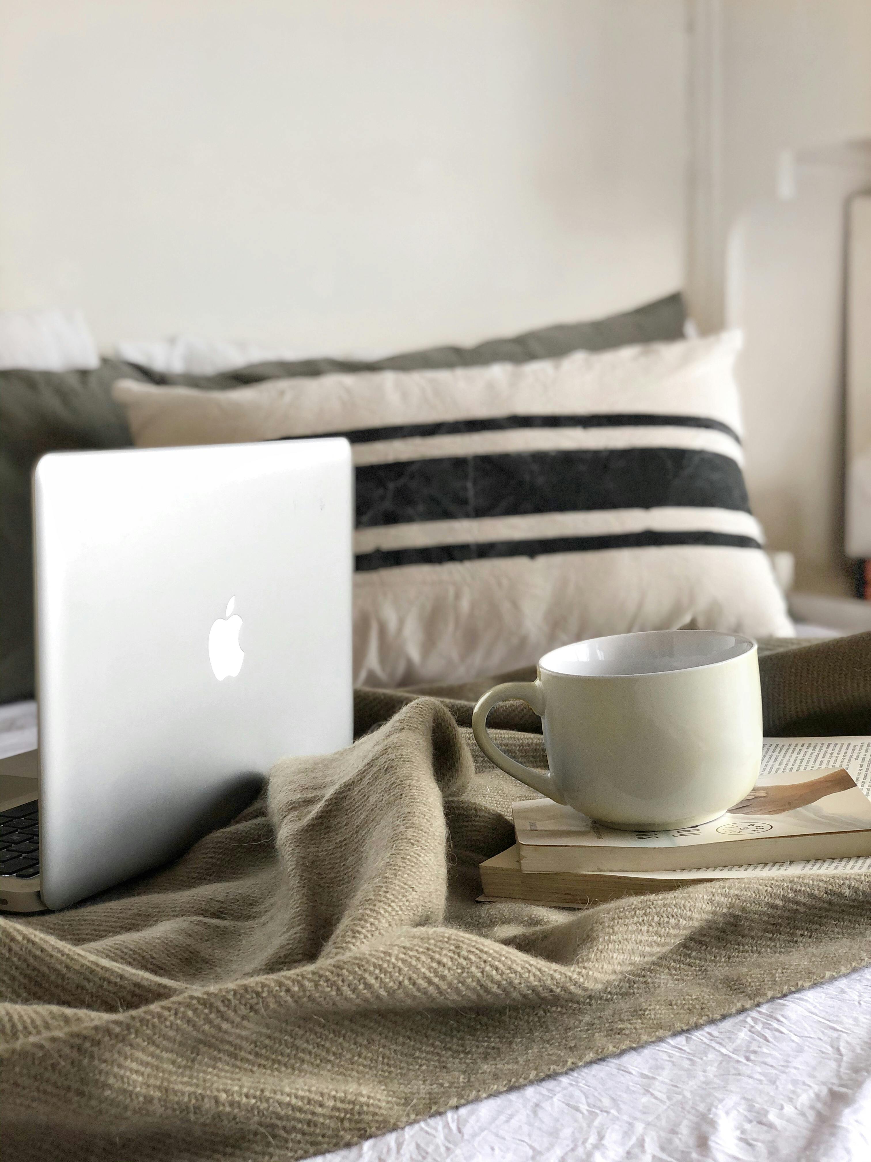 Book and a Cup of Coffee on the Bed · Free Stock Photo