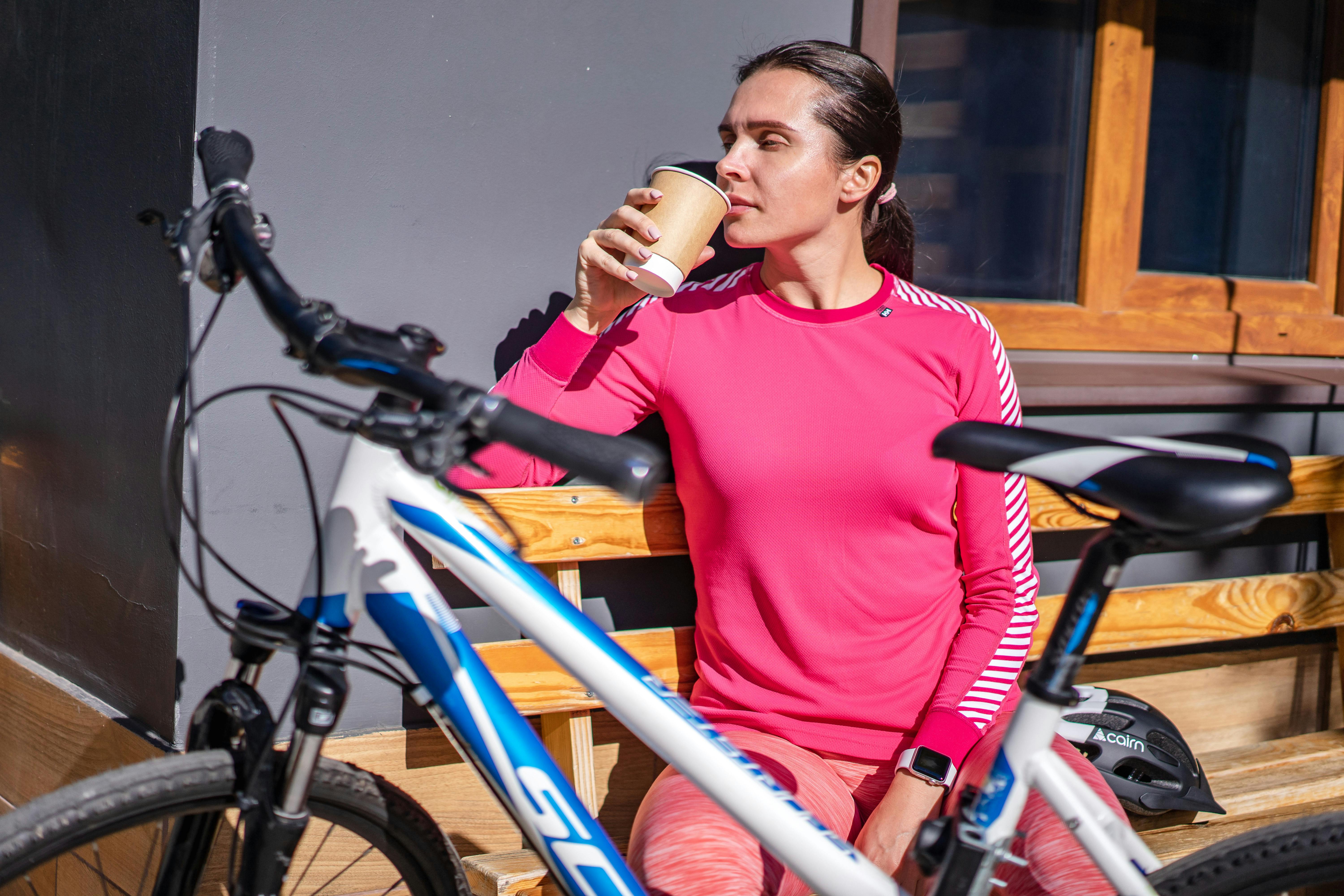 Cyclist Resting on Bench · Free Stock Photo