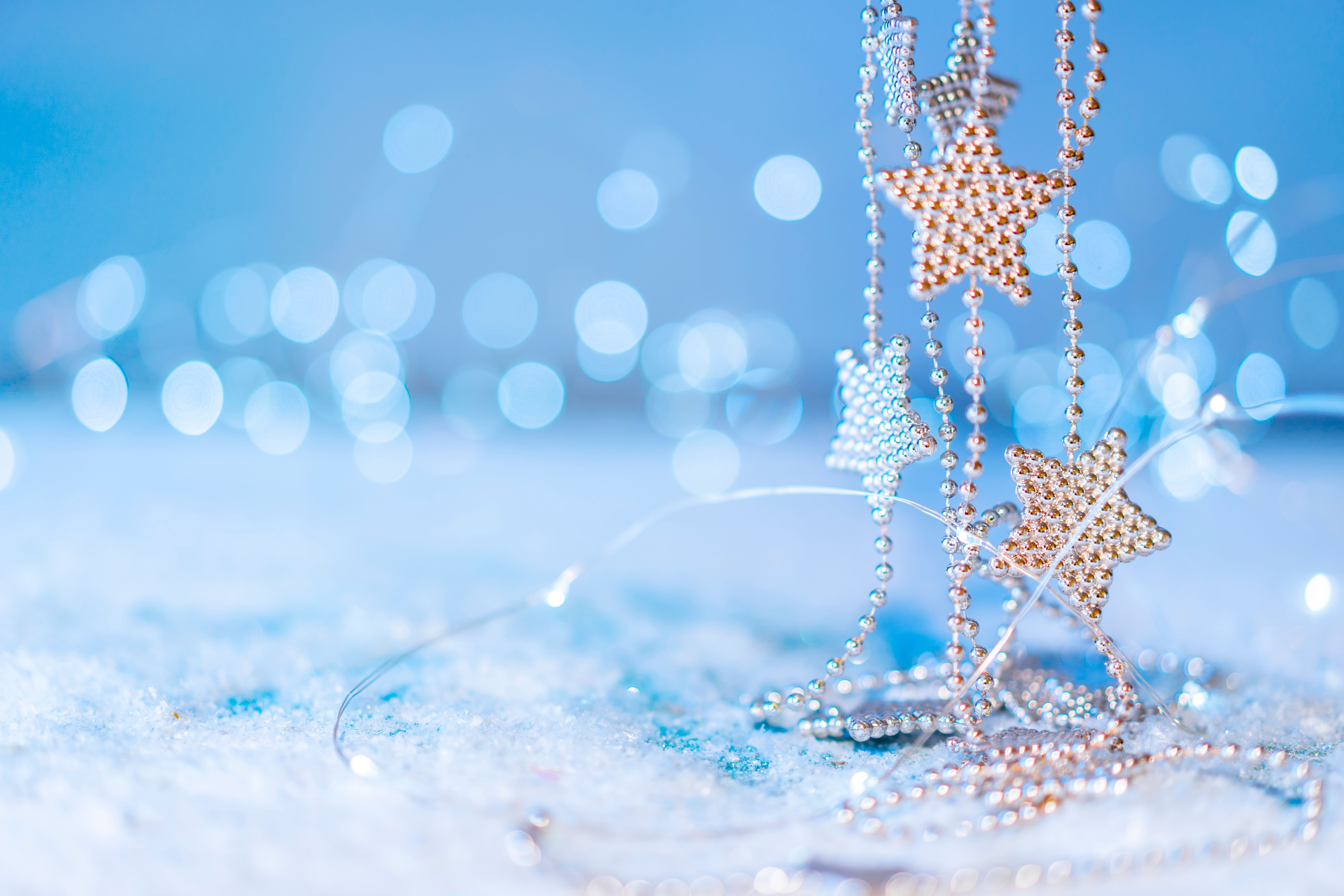 Silver String Beads with Stars Design · Free Stock Photo