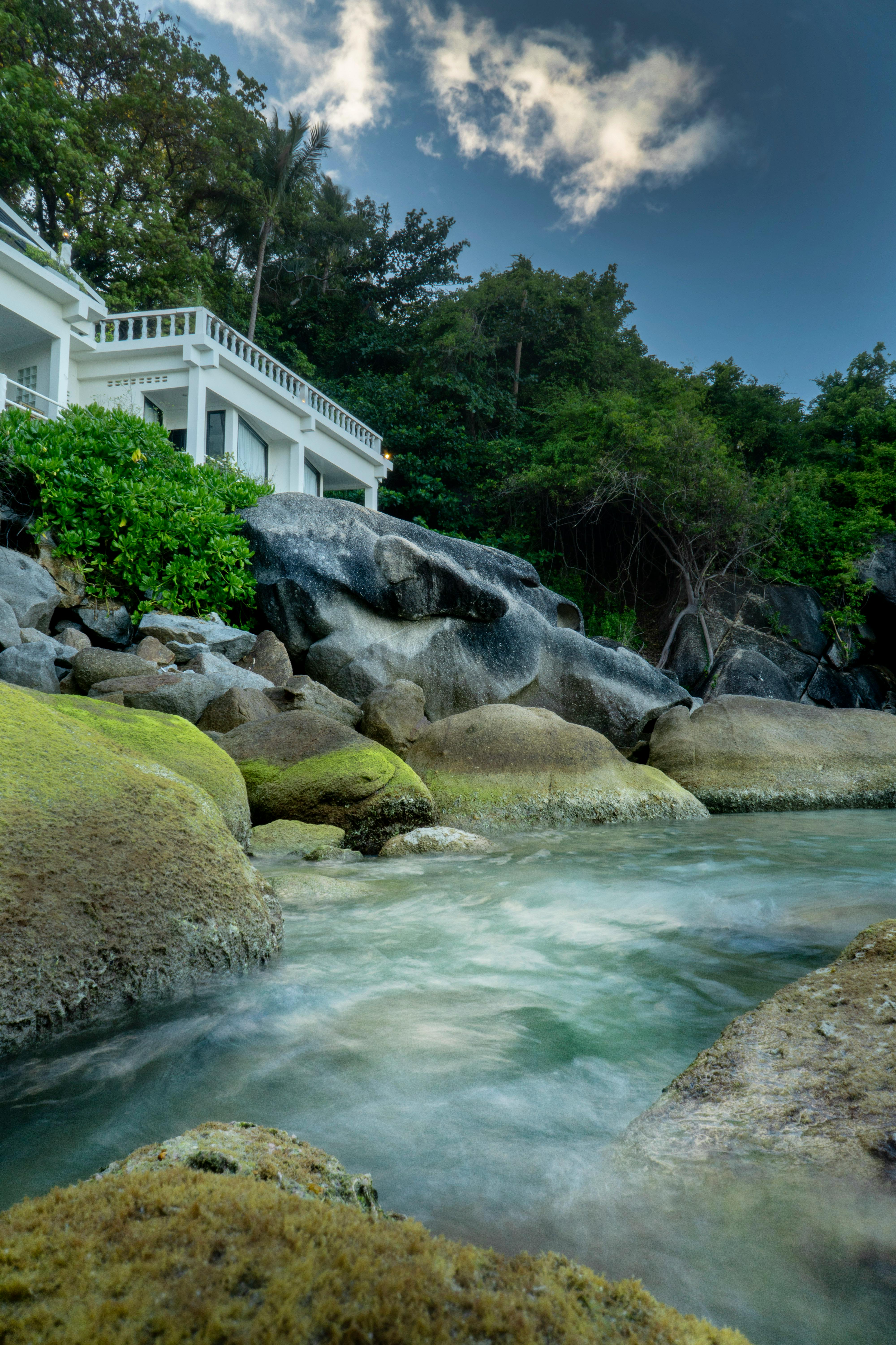 House Next to a Waterfall and a Forest · Free Stock Photo