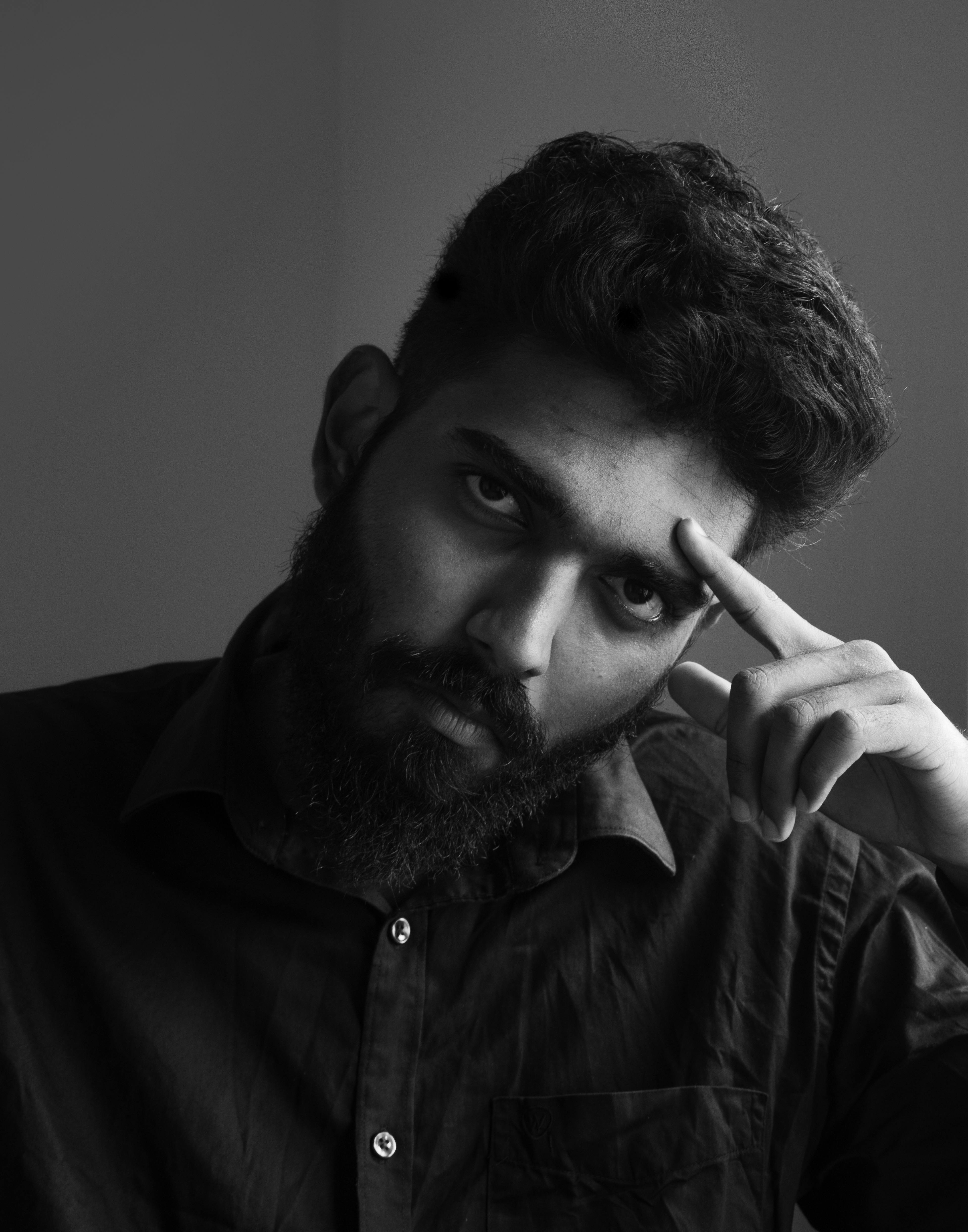 Grayscale Photo of a Man with Necklaces · Free Stock Photo