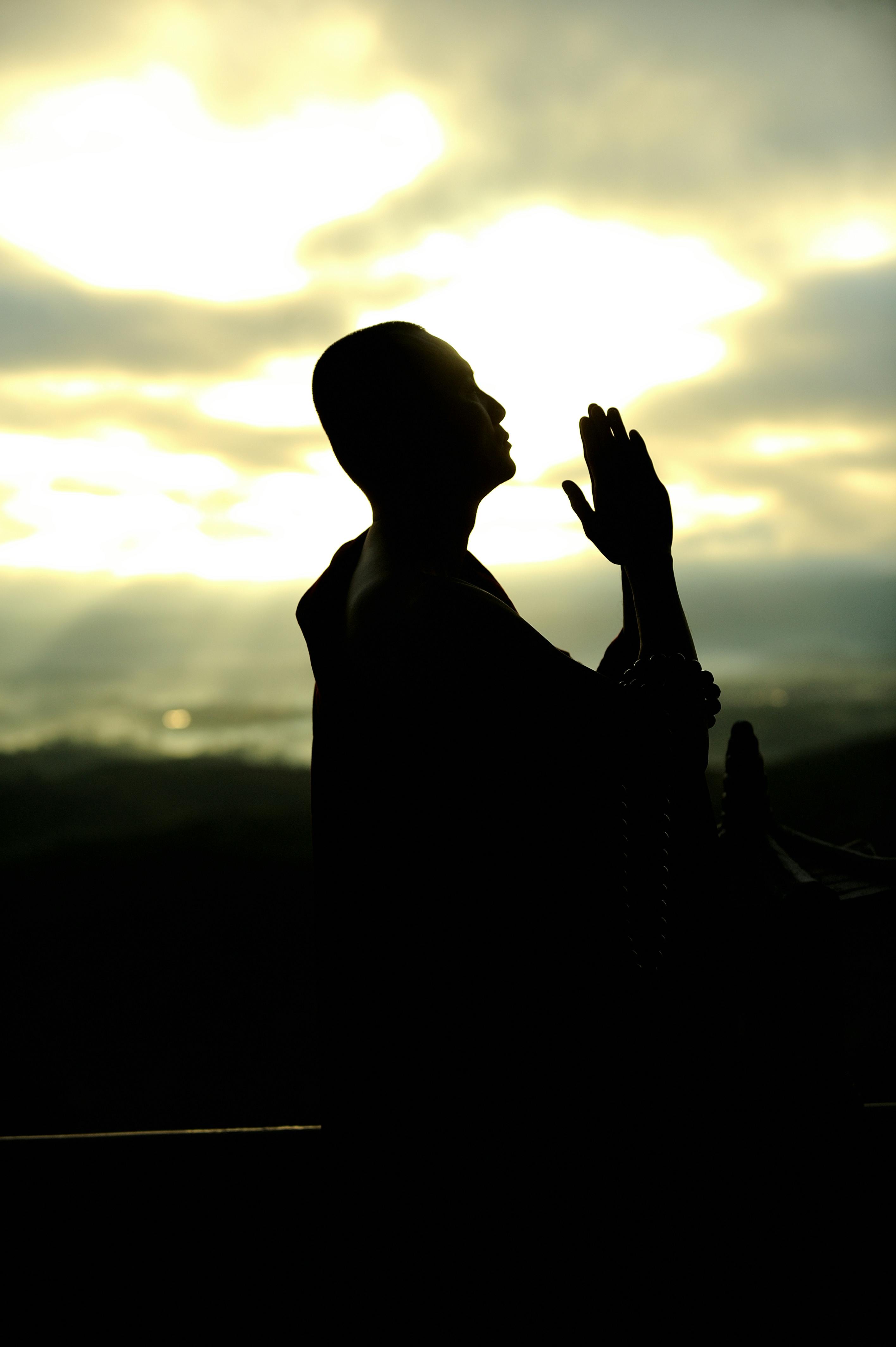 Silhouette of Man Praying · Free Stock Photo