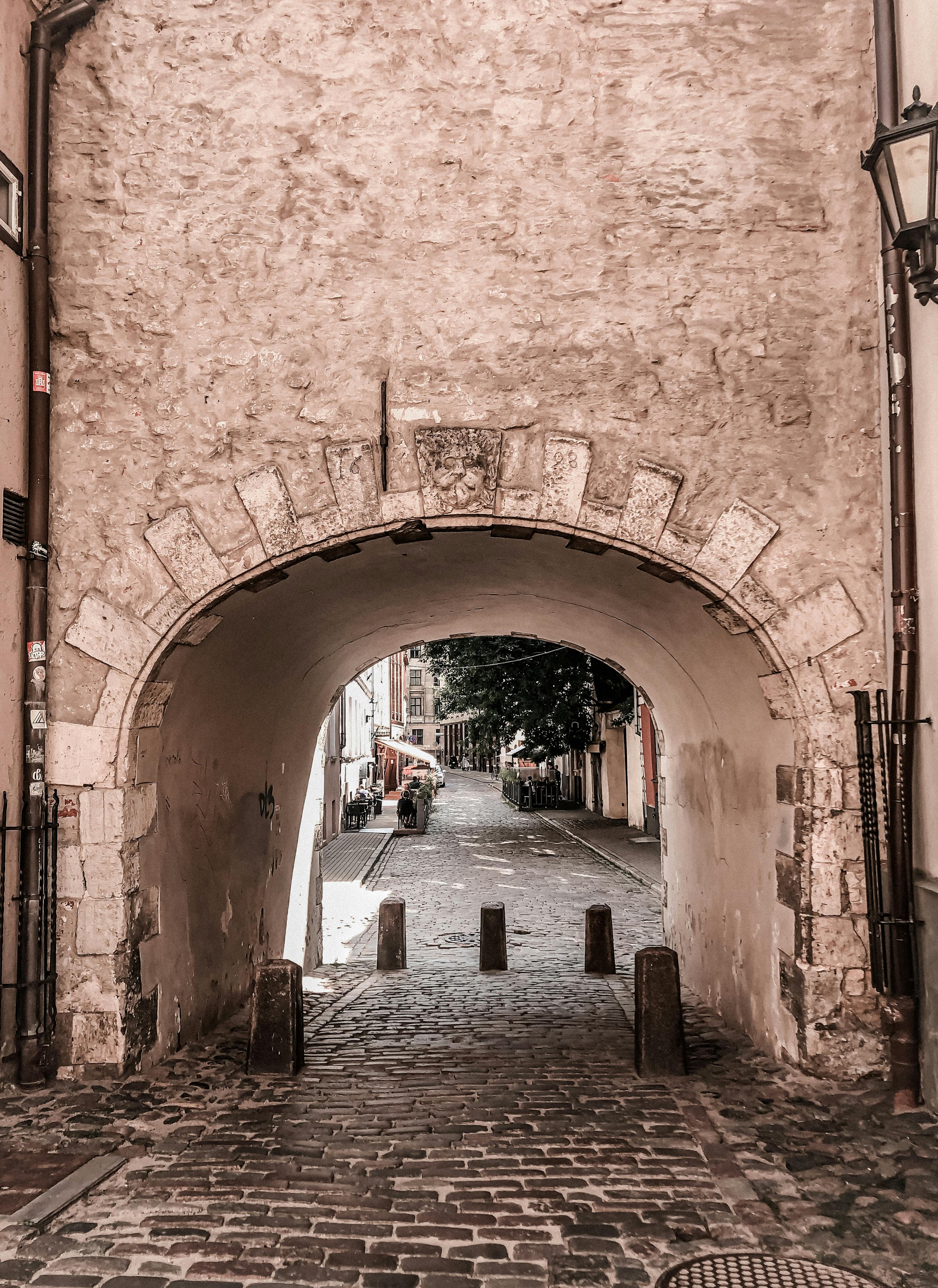 Cobblestone Street Through the Swedish Gate in Riga · Free Stock Photo
