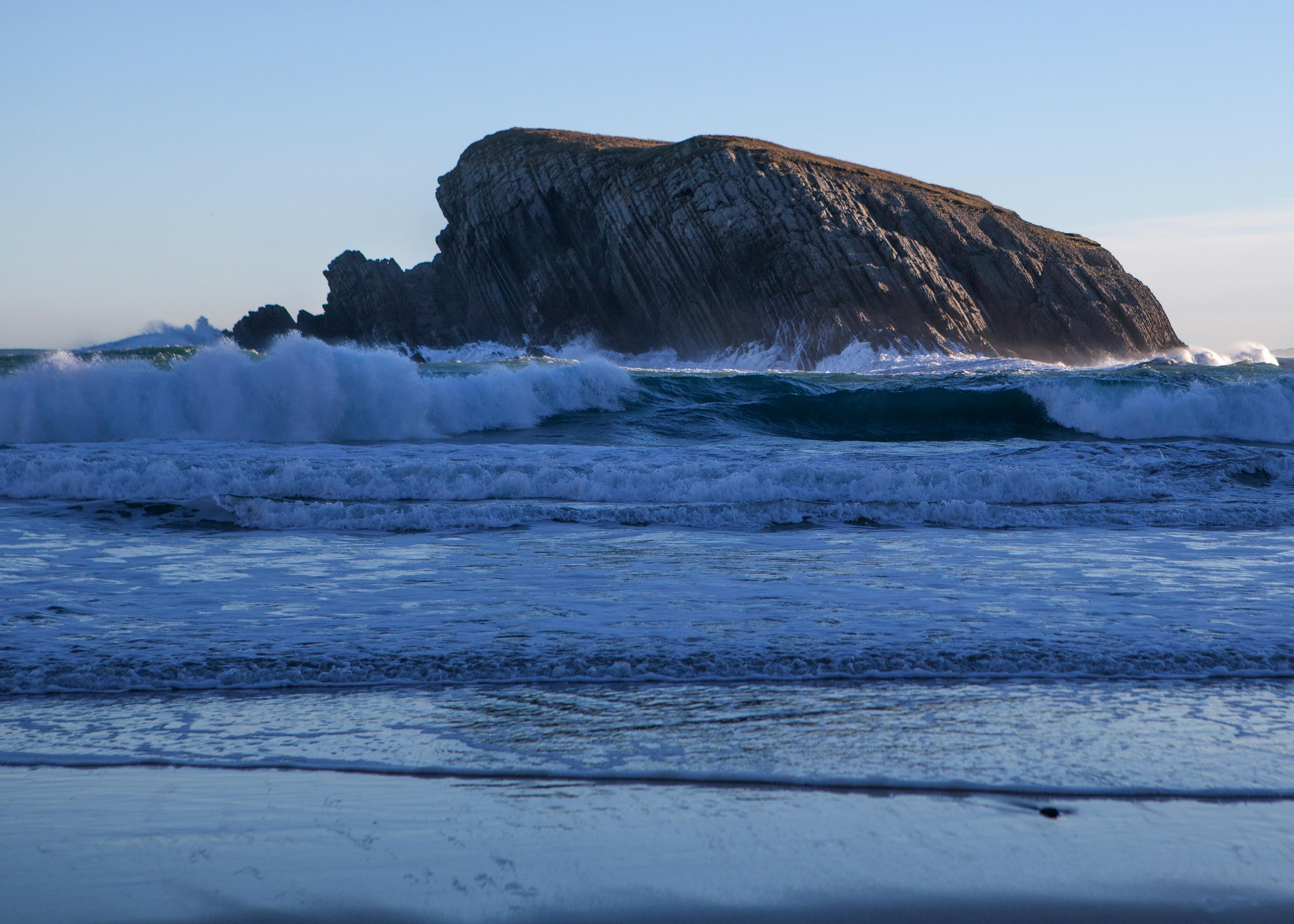 Rock Formation on Sea Water With Waves · Free Stock Photo
