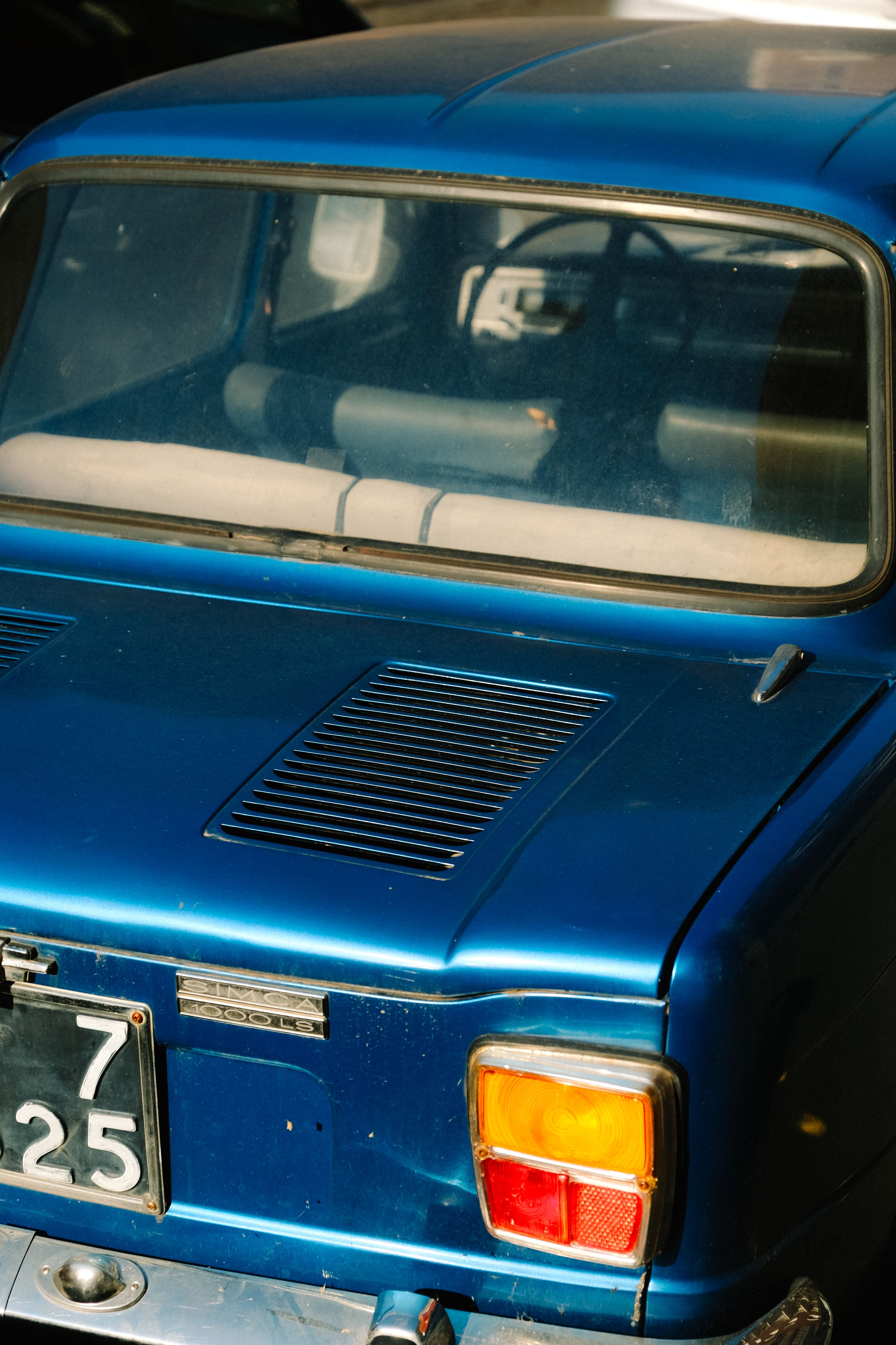 Close-Up Shot of a Blue Car · Free Stock Photo