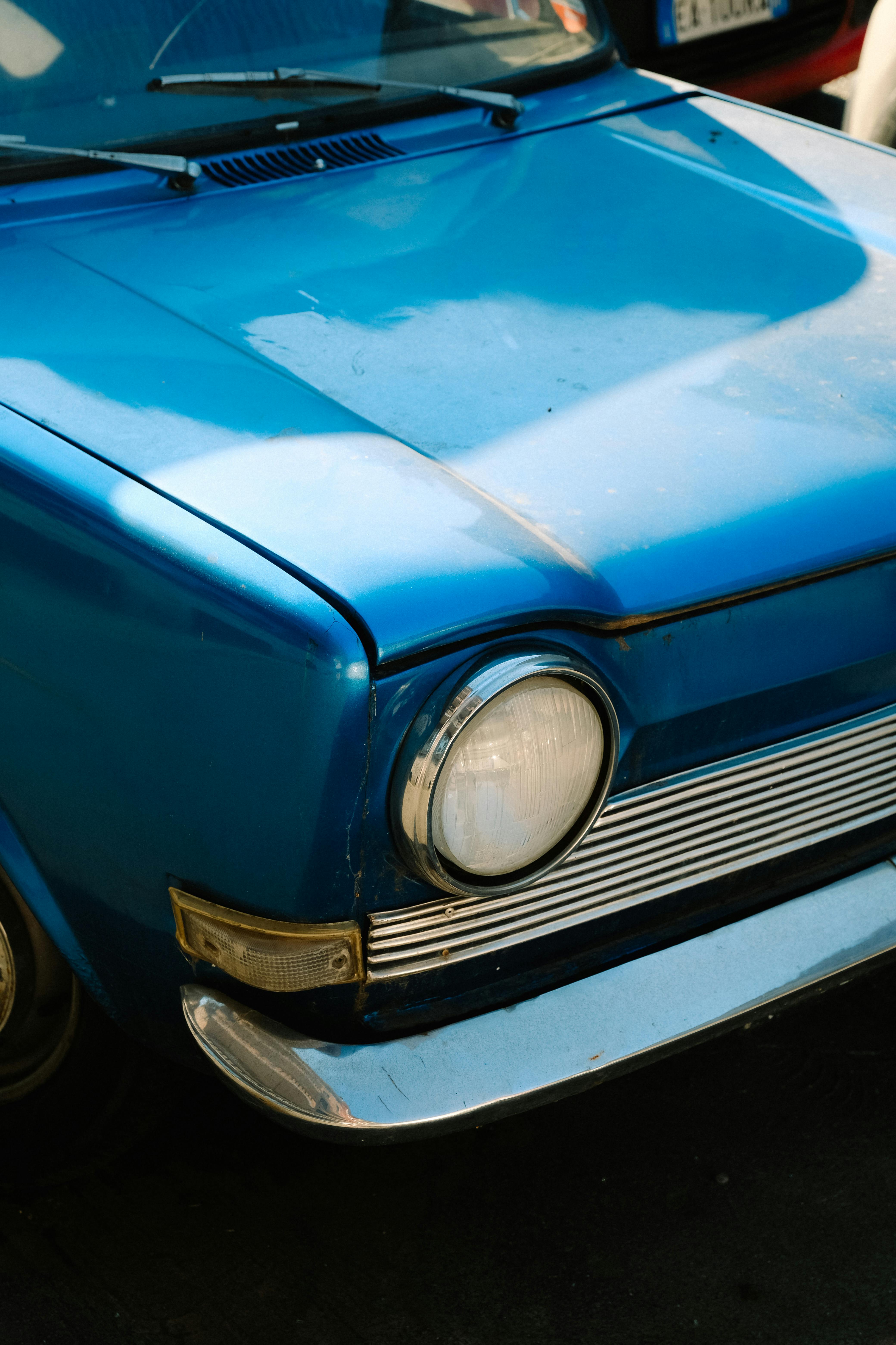 A Blue Car in Close-Up Photography · Free Stock Photo