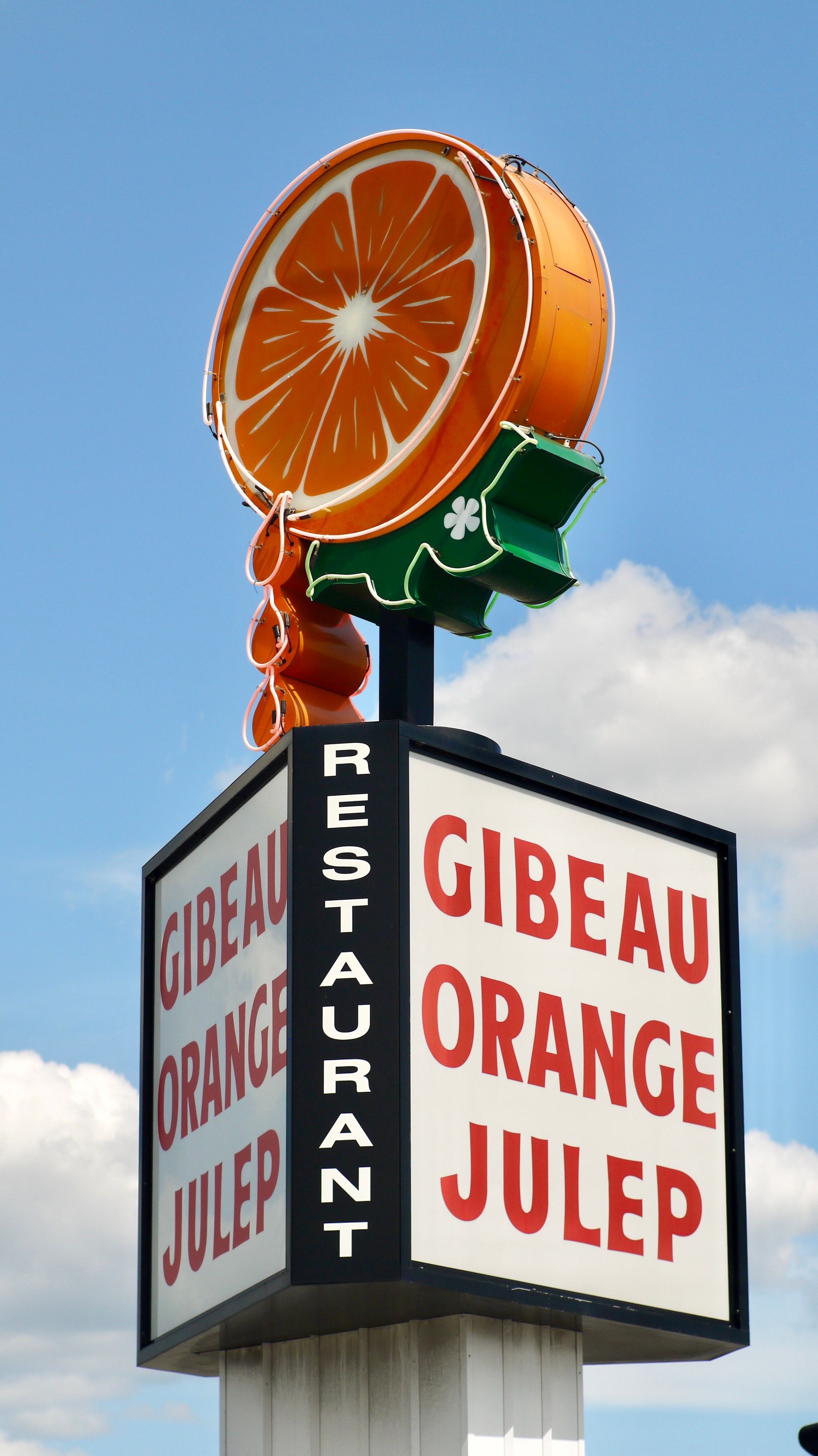 Orange on Top of Restaurant Board · Free Stock Photo