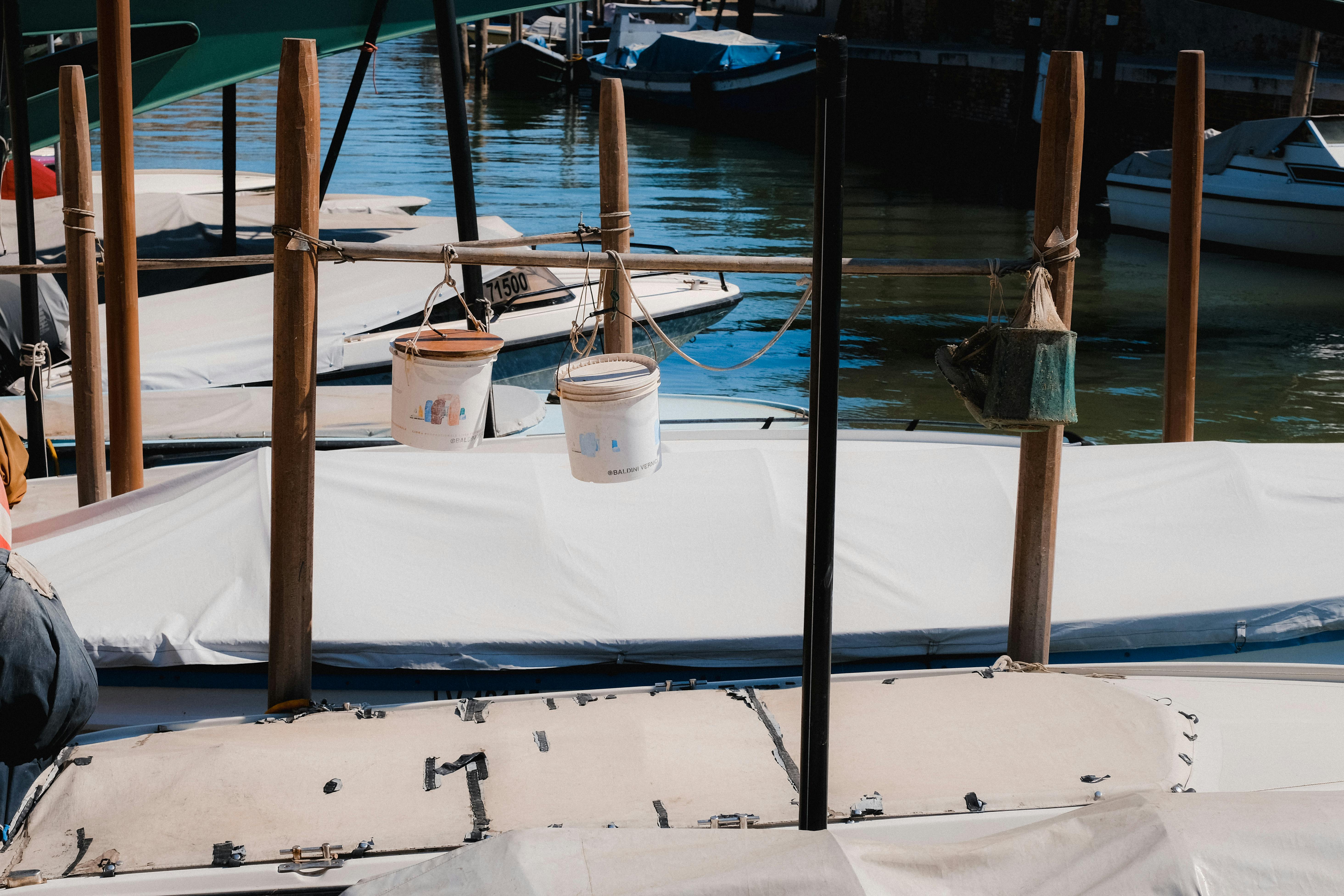Hanging Buckets on Wooden Stick · Free Stock Photo