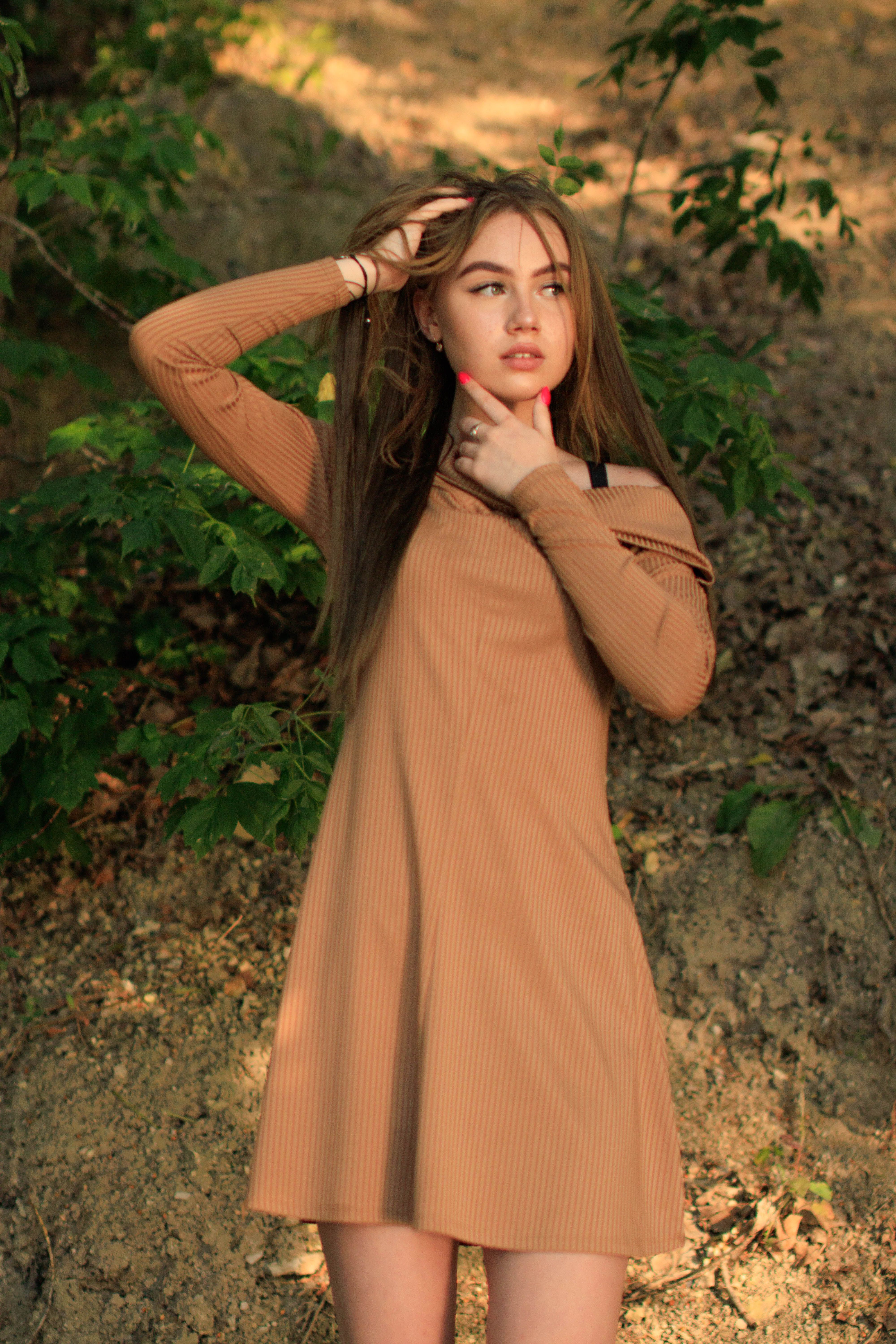 A Pretty Woman in Brown Dress · Free Stock Photo