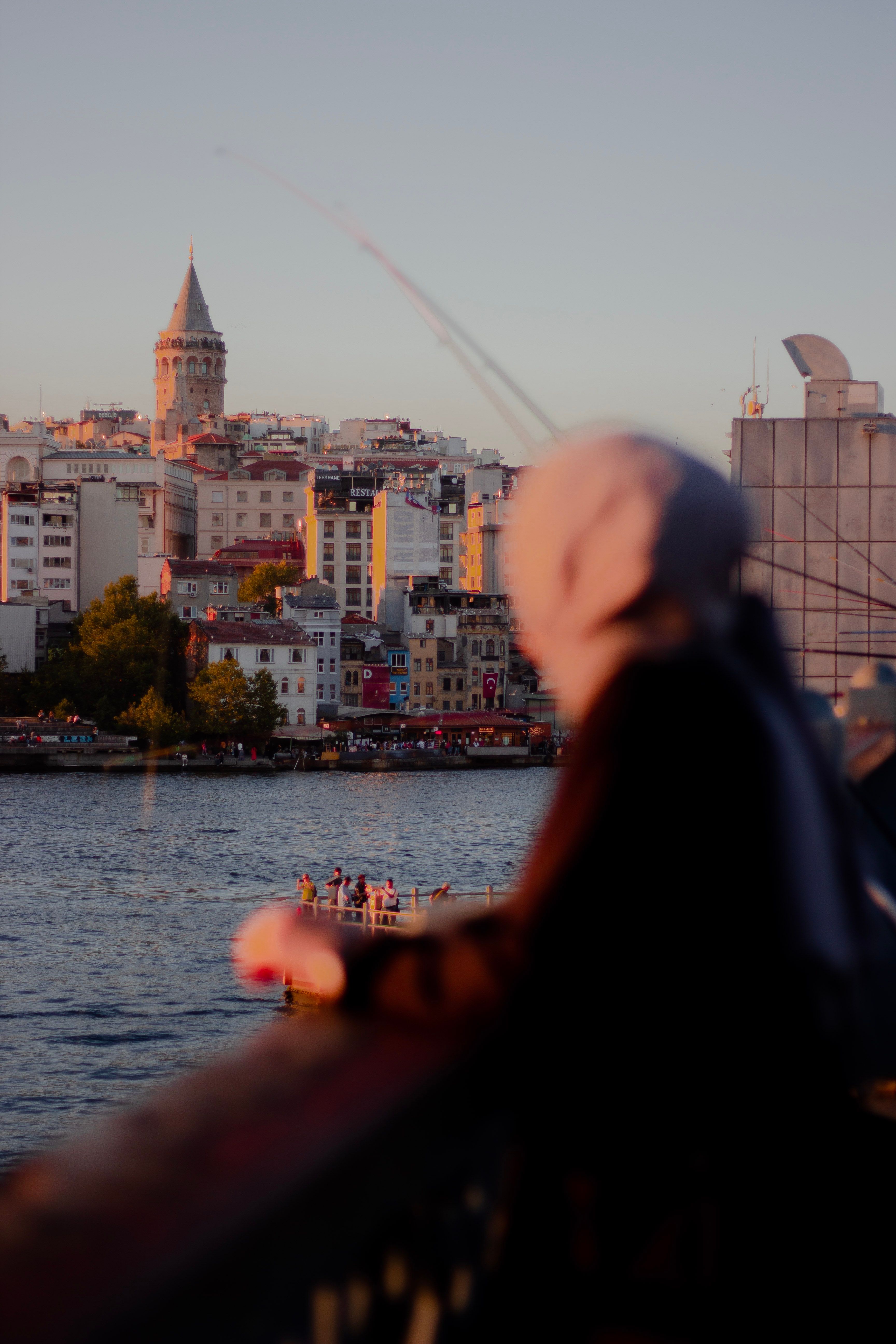 People Walking on Galata Bridge with View of Galata Tower on Background ...