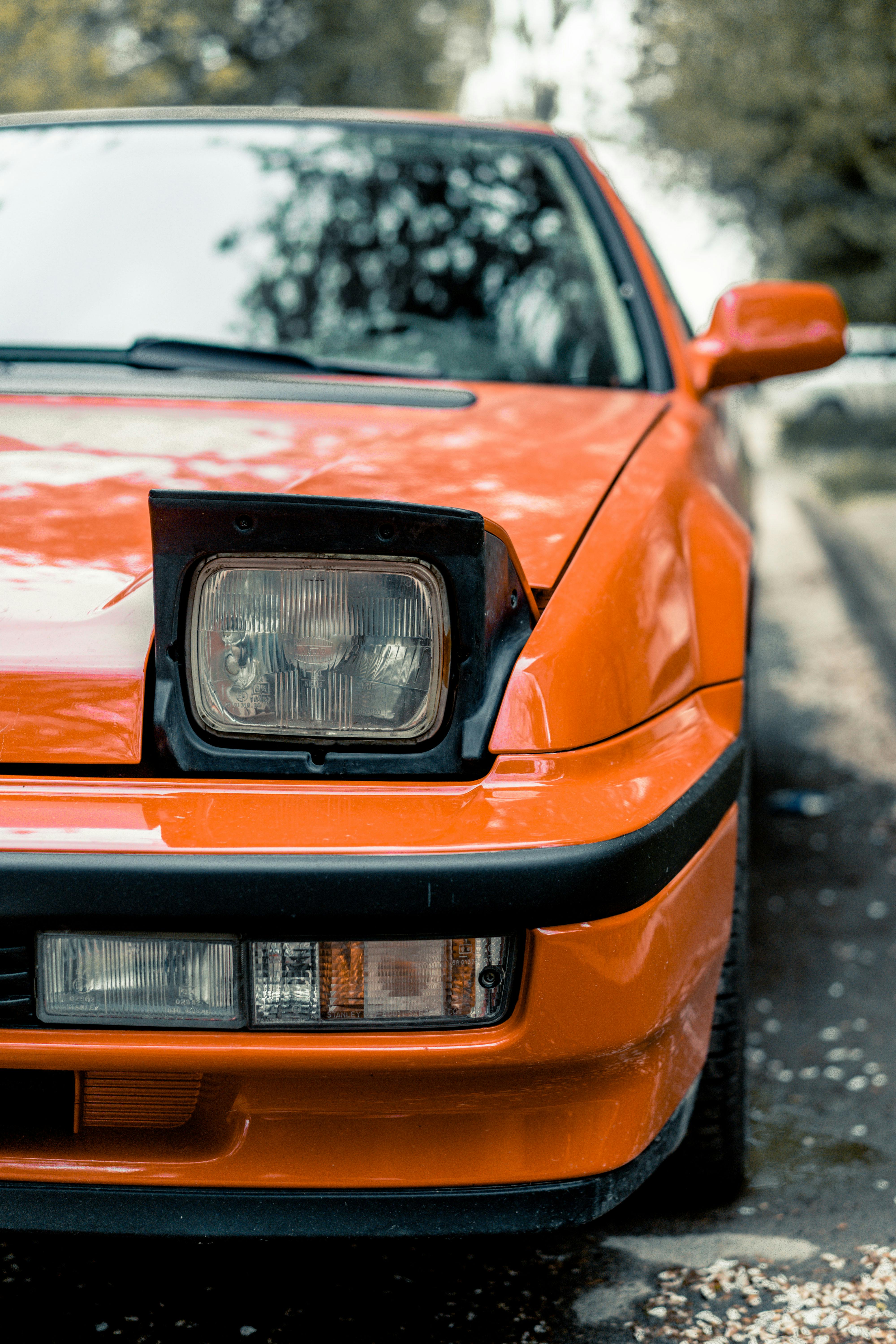 Retro Orange Car Parked by Roadside · Free Stock Photo