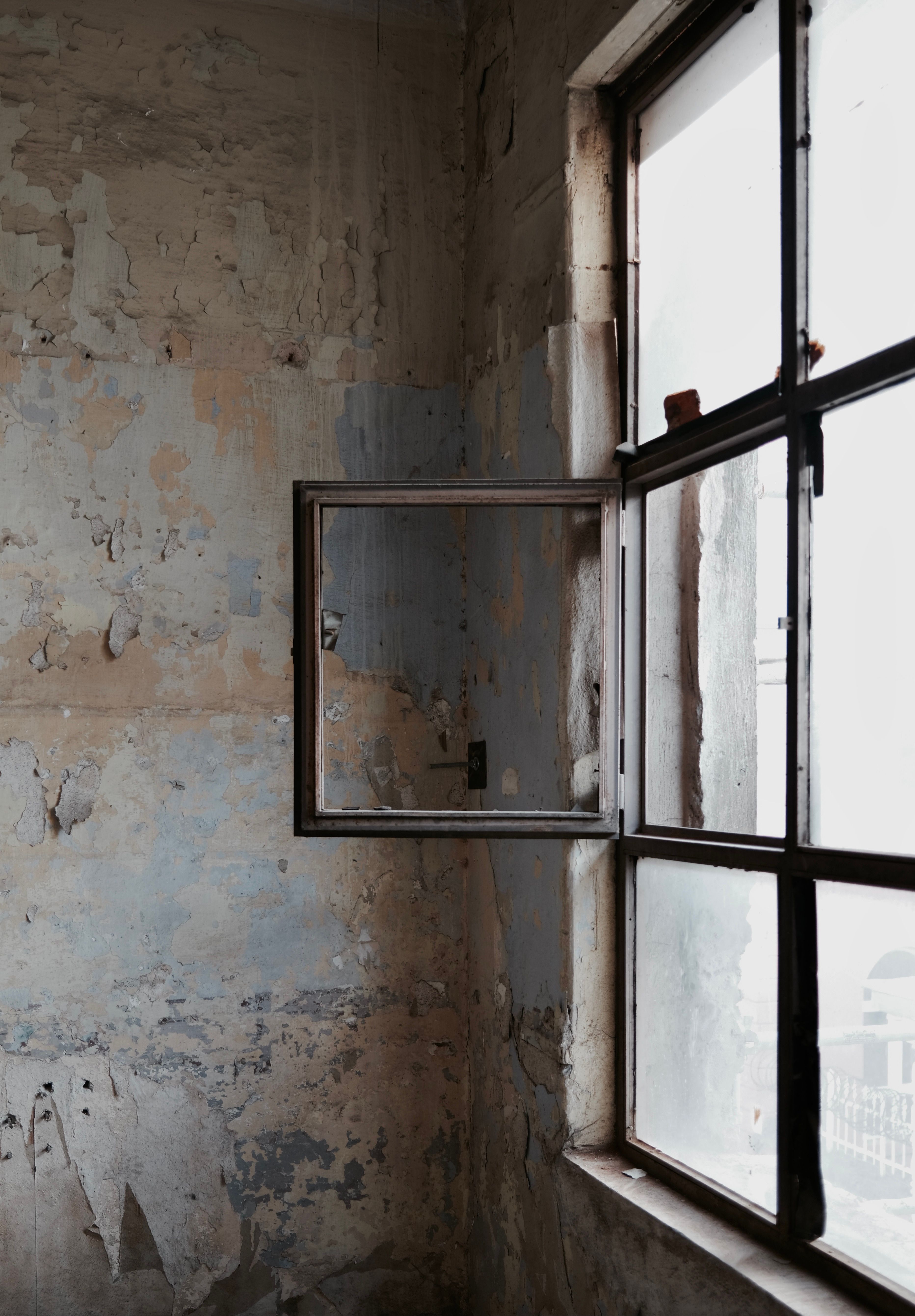Black Metal Window Frame on White Concrete Wall · Free Stock Photo
