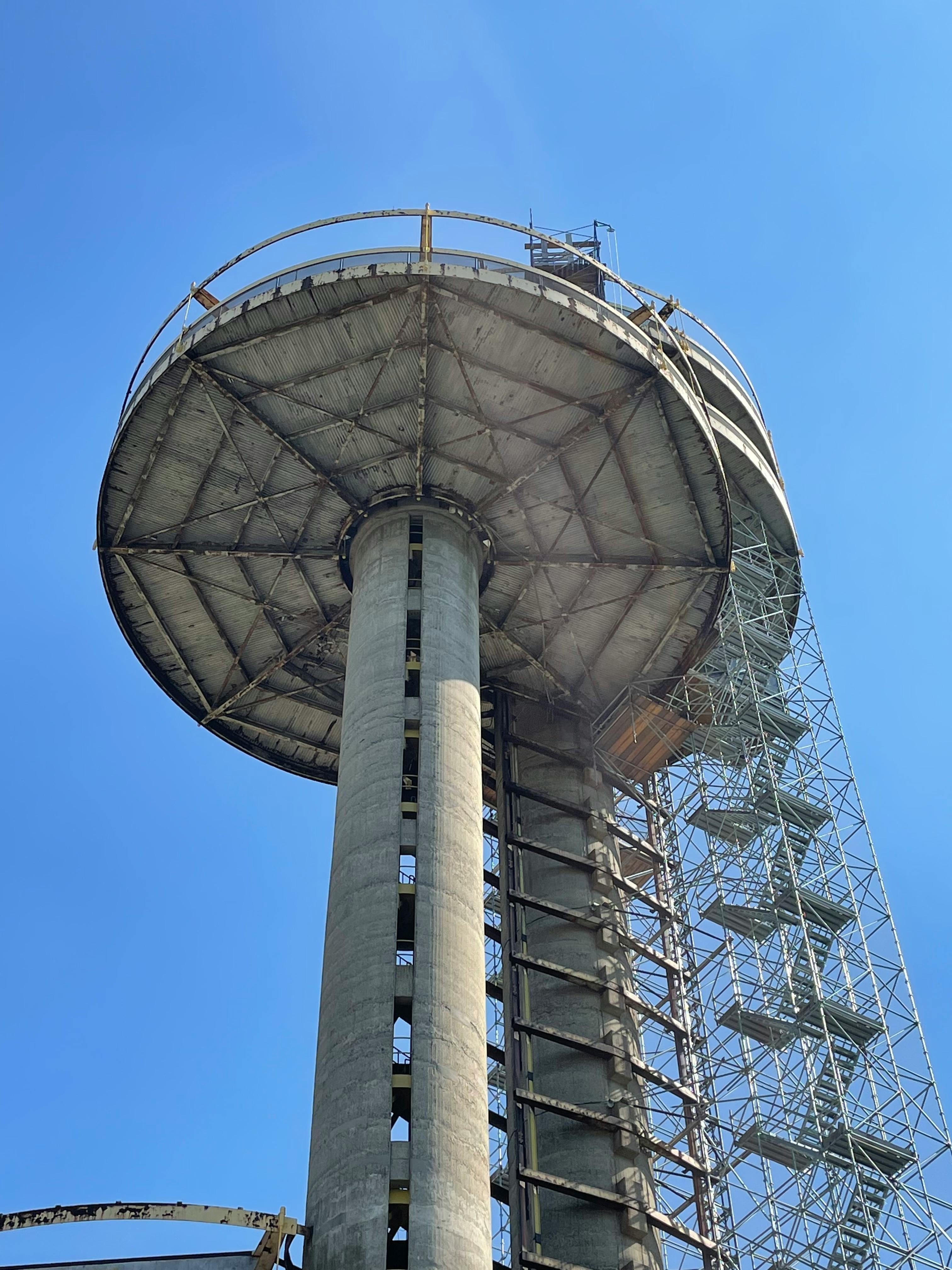 Low Angle Shot of a Gray Tower · Free Stock Photo