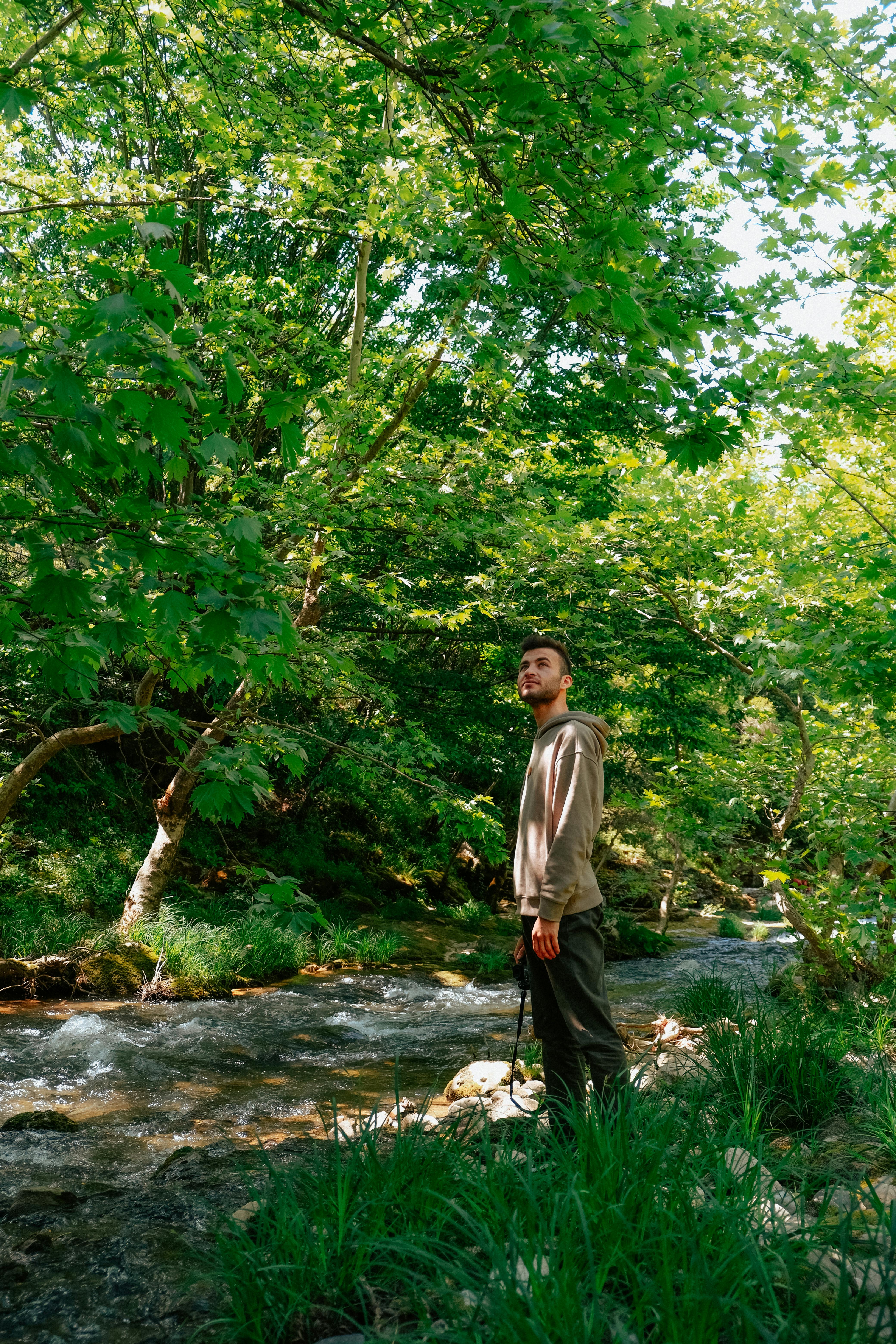 Photo of a Man Standing Near a River · Free Stock Photo