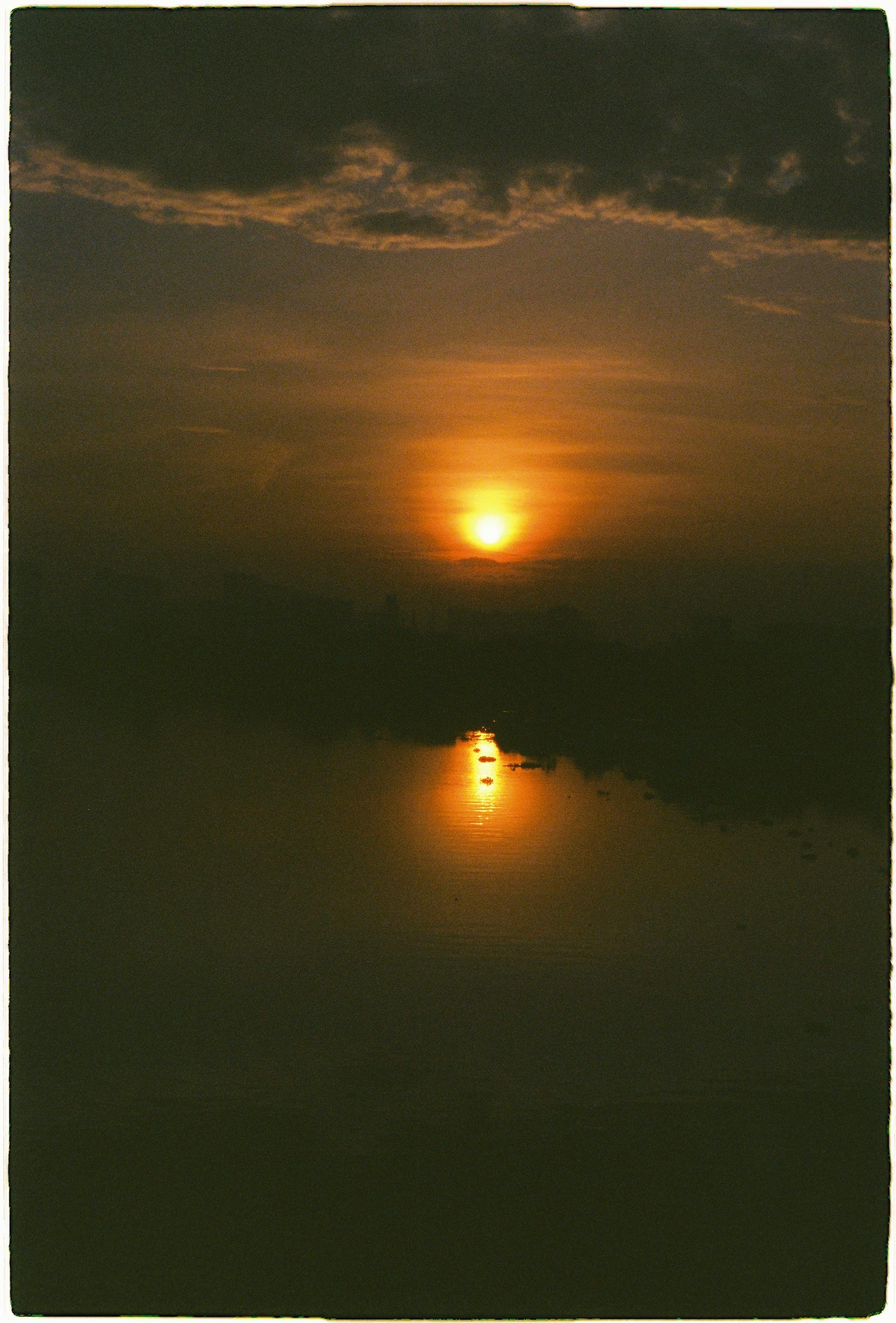Golden Sun Setting over Body of Water · Free Stock Photo