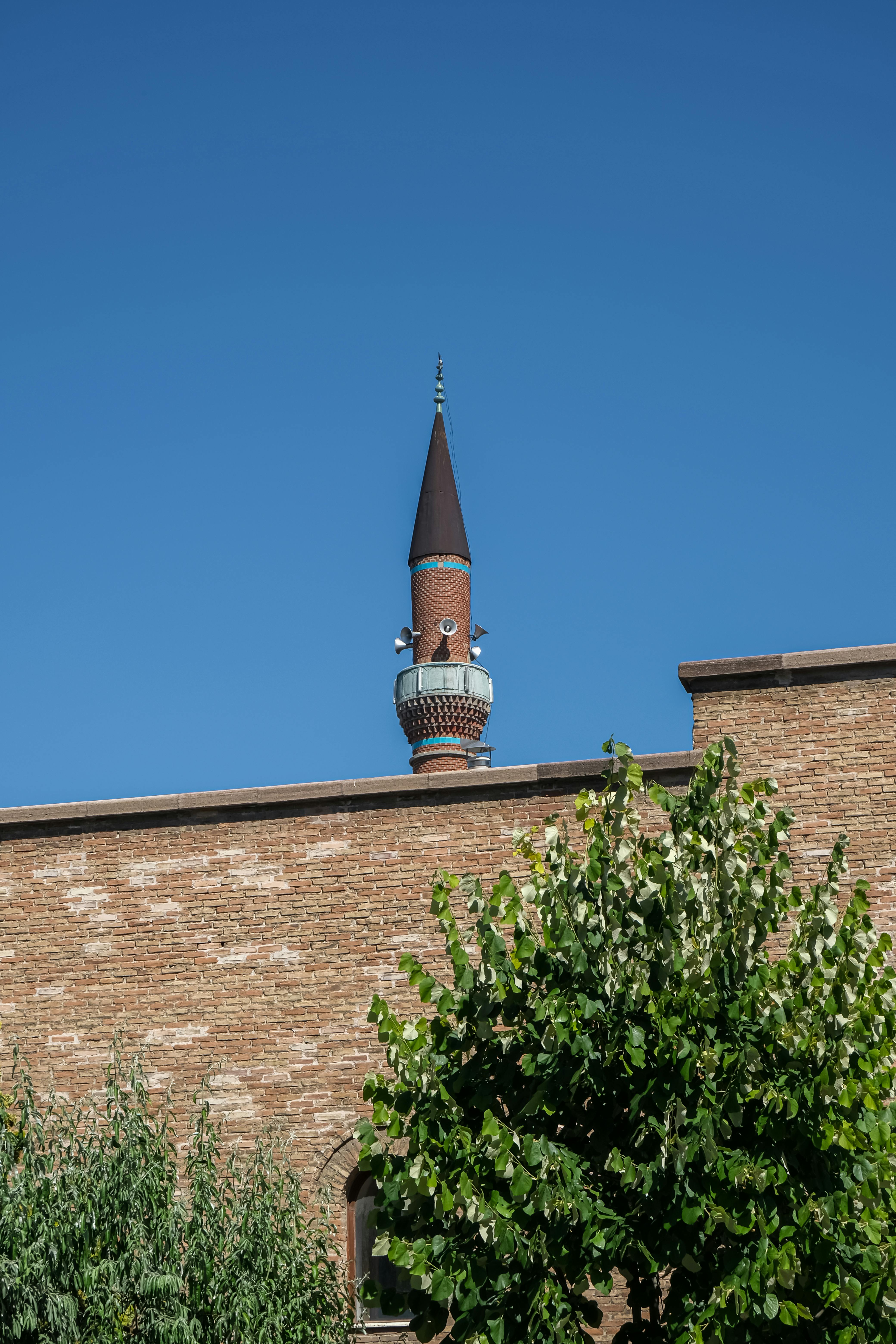 Brown and Black Minaret Under the Blue Sky · Free Stock Photo