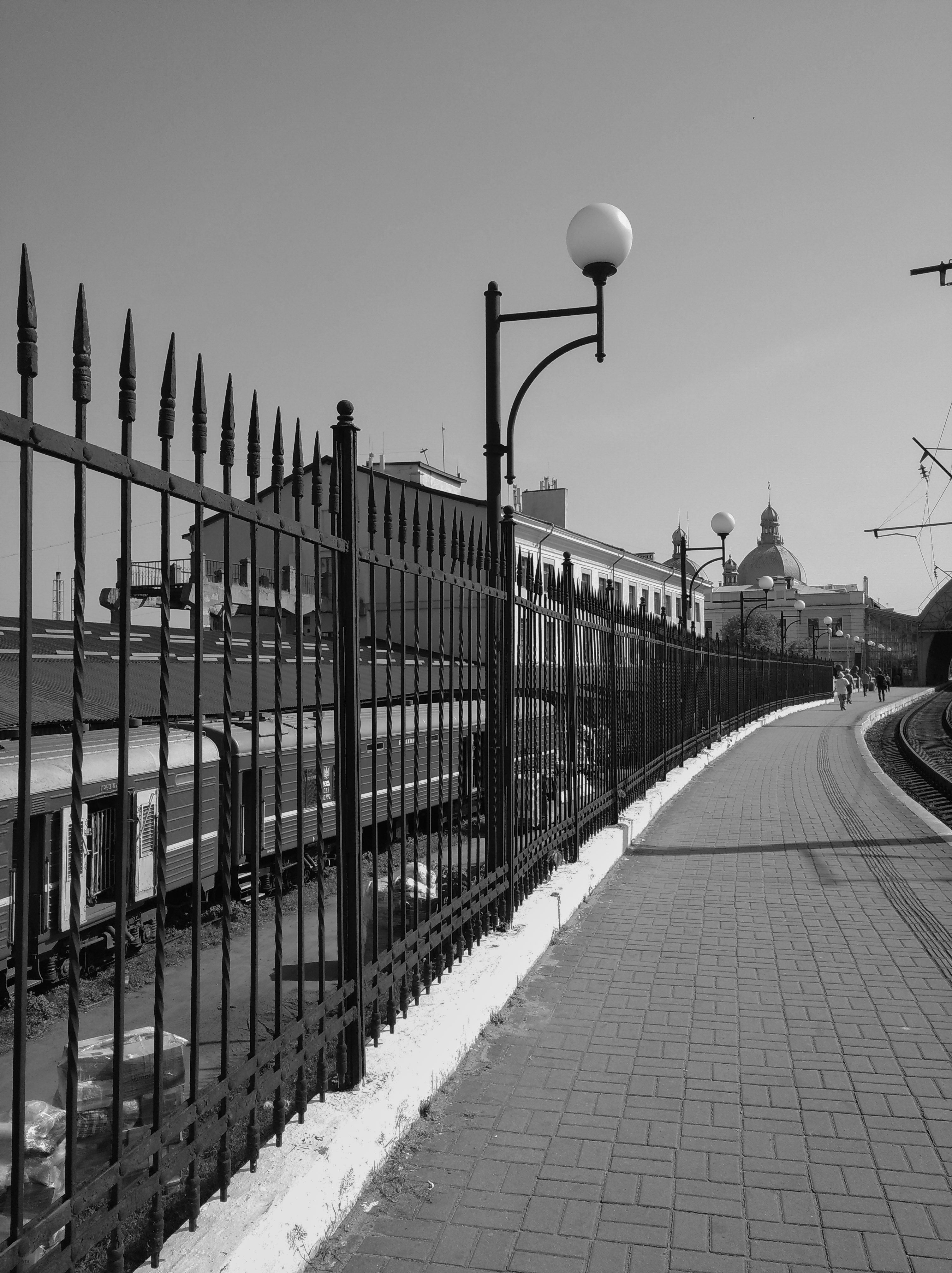 Grayscale Photo Metal Railings on the Street · Free Stock Photo