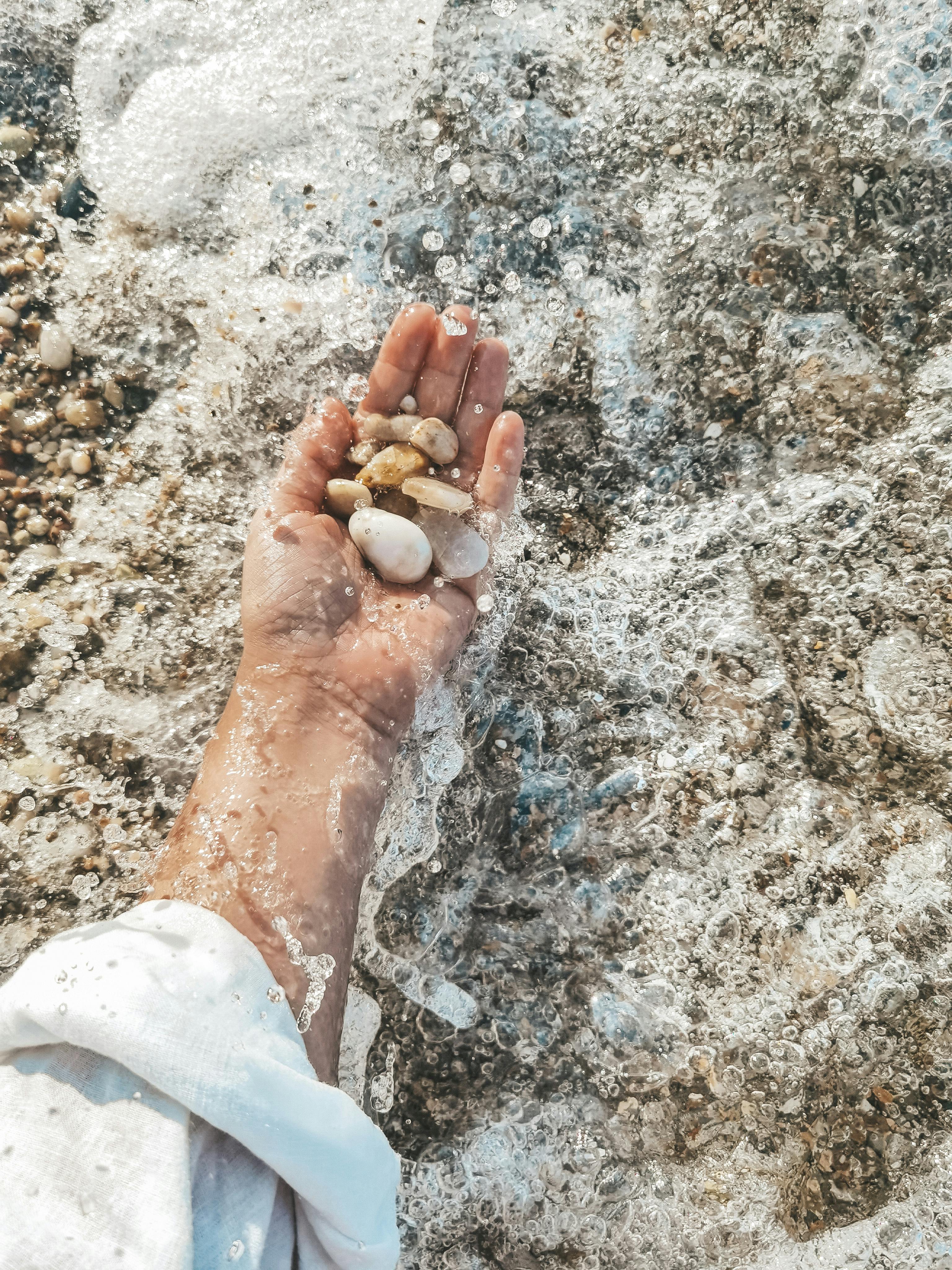Handful of Pebbles from Sea · Free Stock Photo