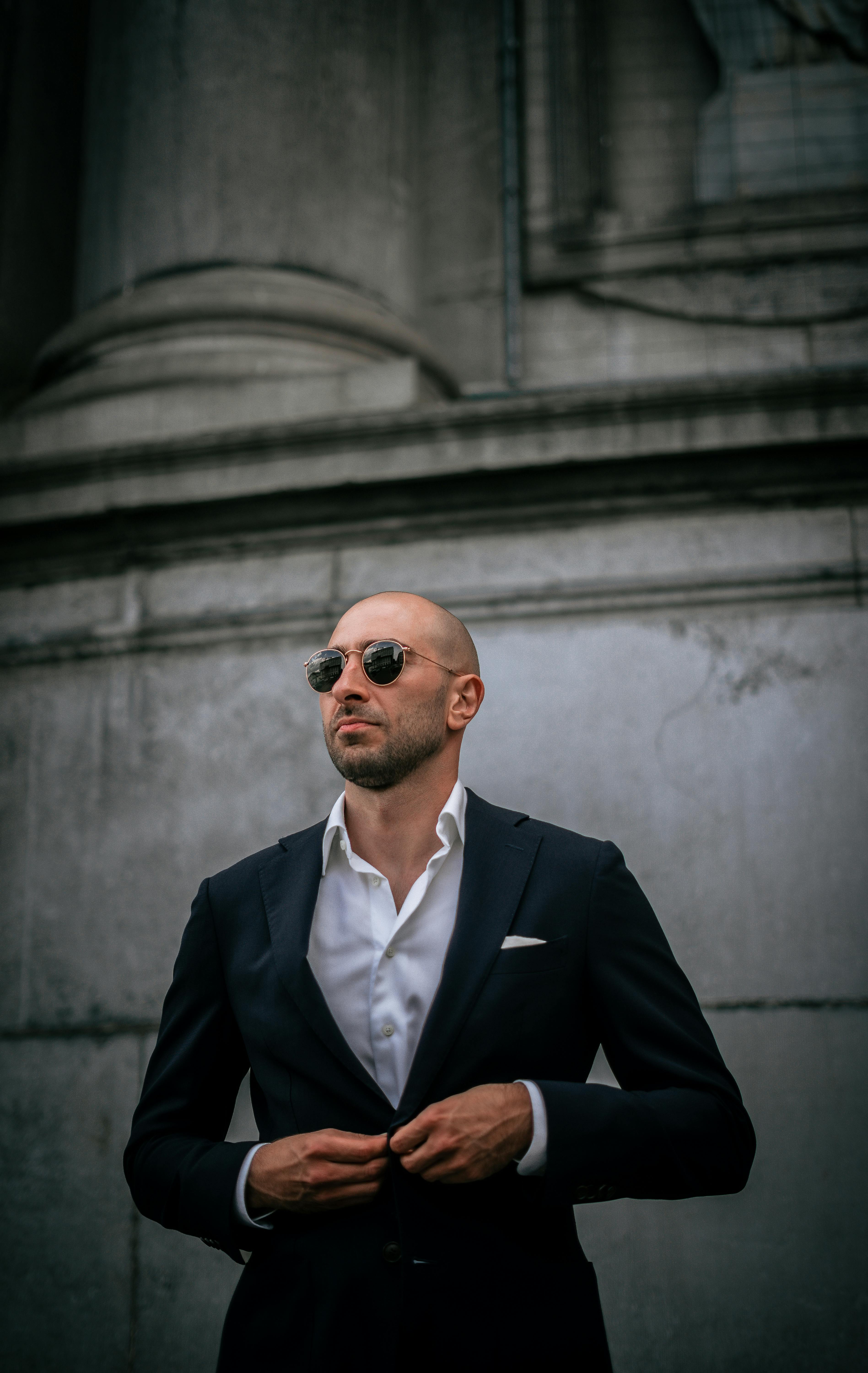 A Man in Black Suit Jacket Wearing Black Sunglasses · Free Stock Photo