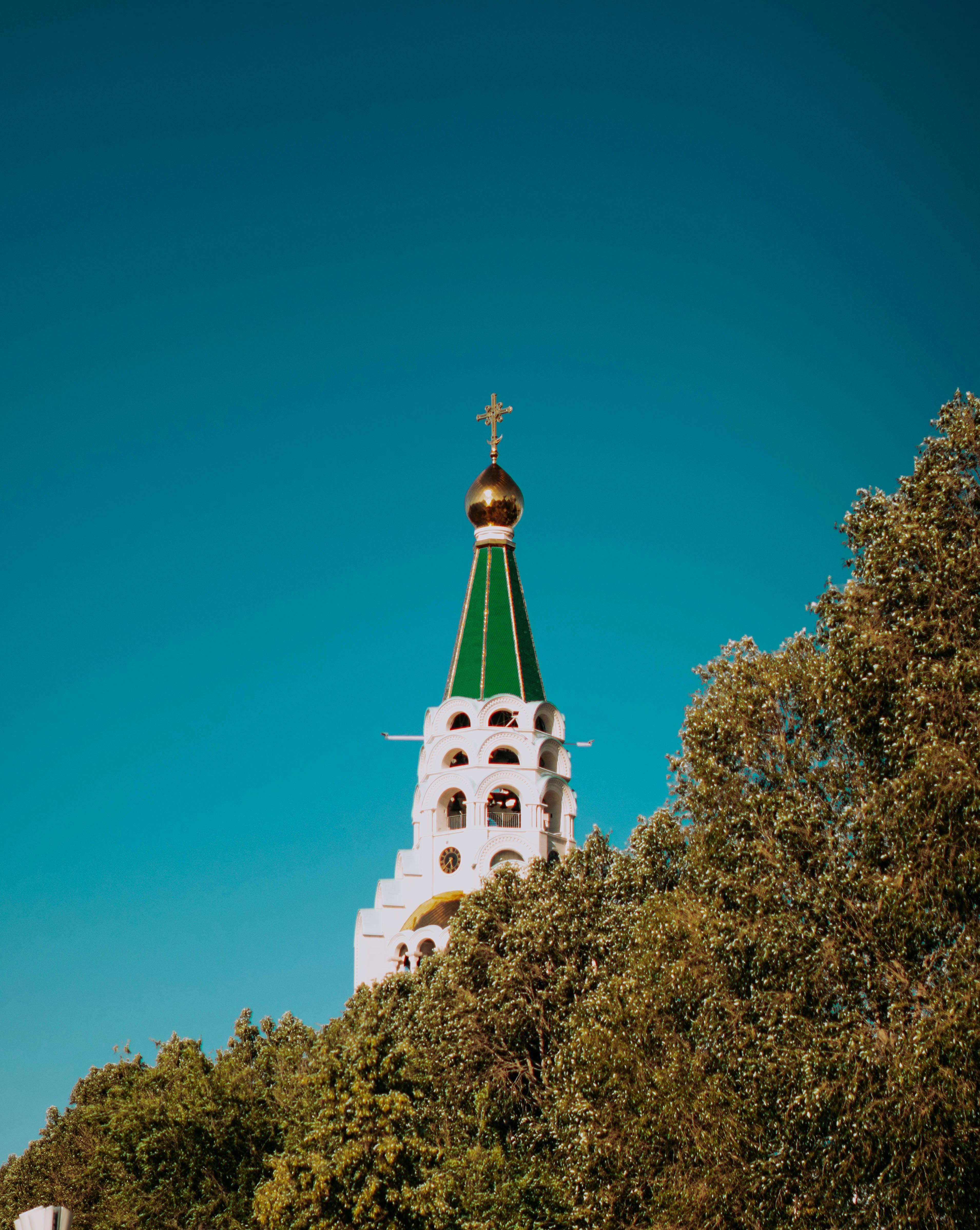 Gray Steeple Under the Cloudy Sky · Free Stock Photo