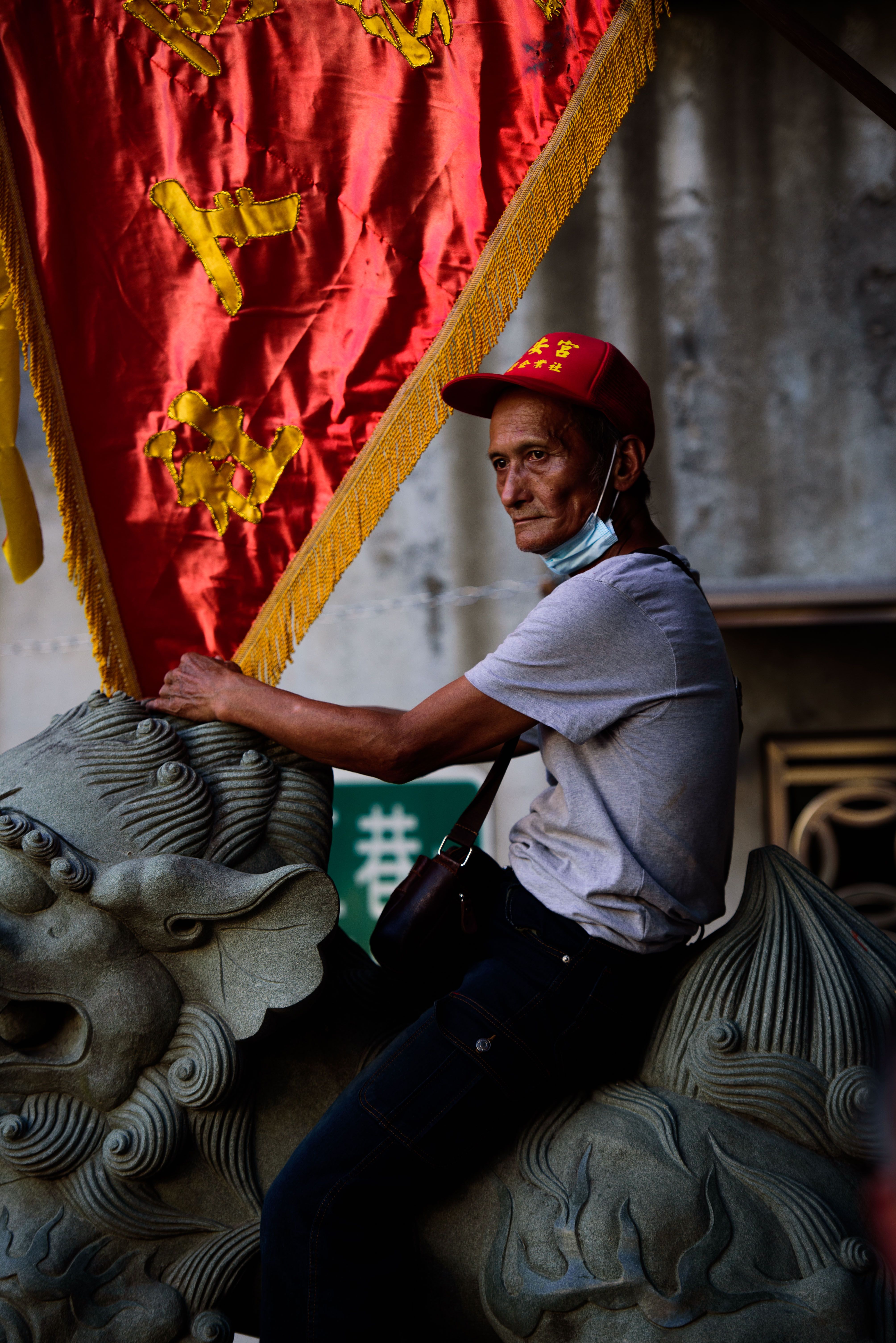 Man Sitting on Statue · Free Stock Photo