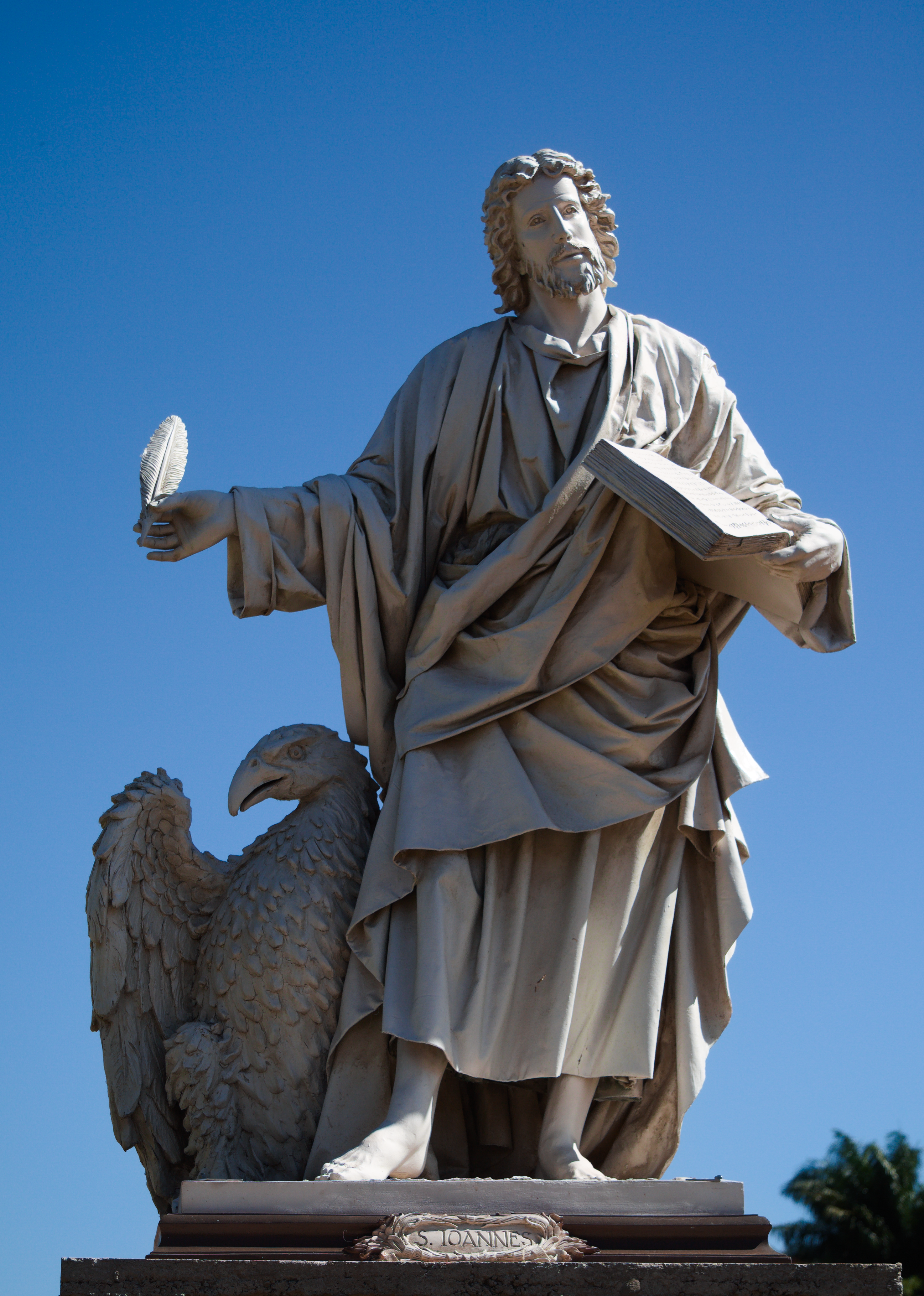 Marble Statue of John the Evangelist against Blue Sky · Free Stock Photo