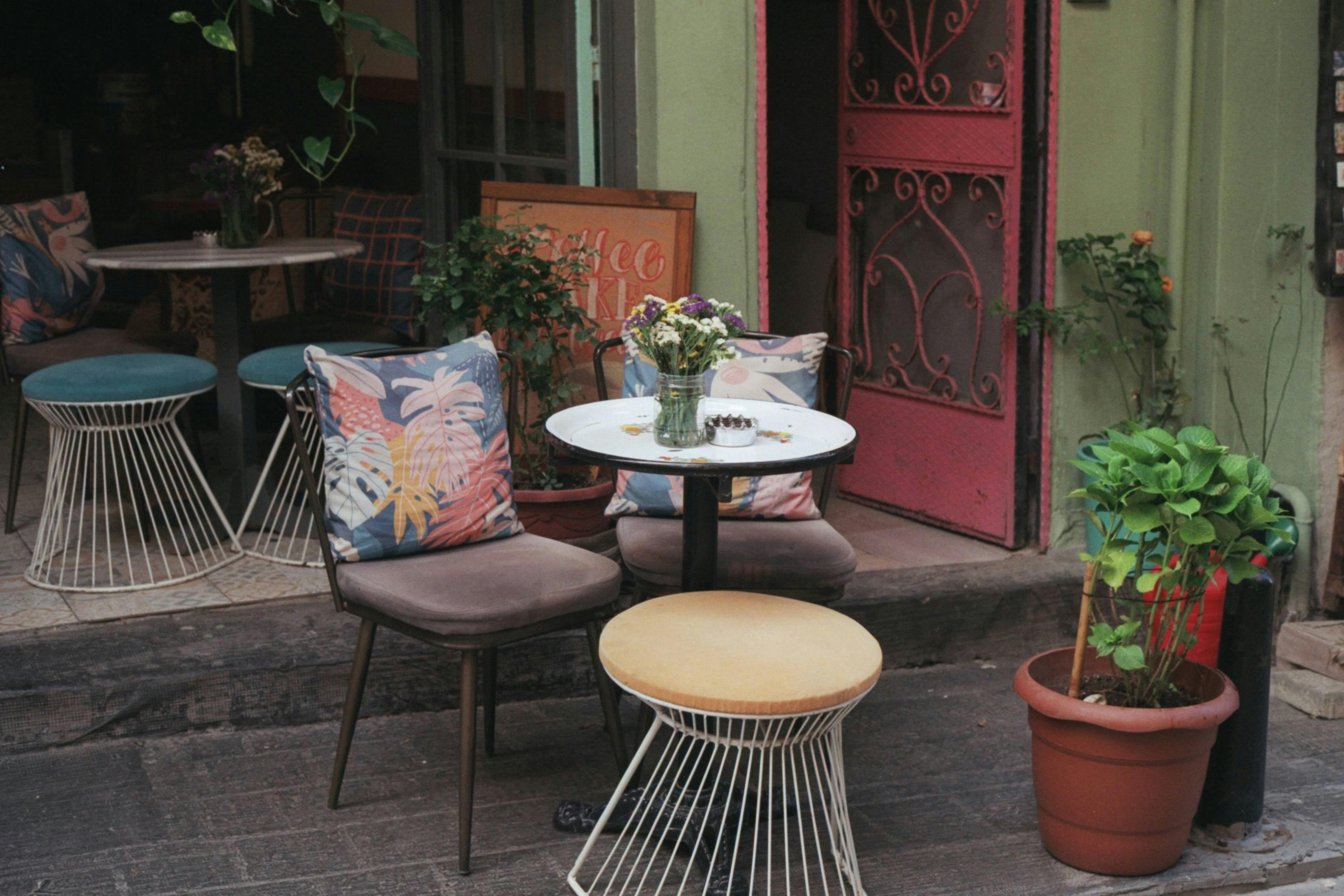 Brown and Orange 3-piece Patio Set Outside A Coffee Shop · Free Stock Photo