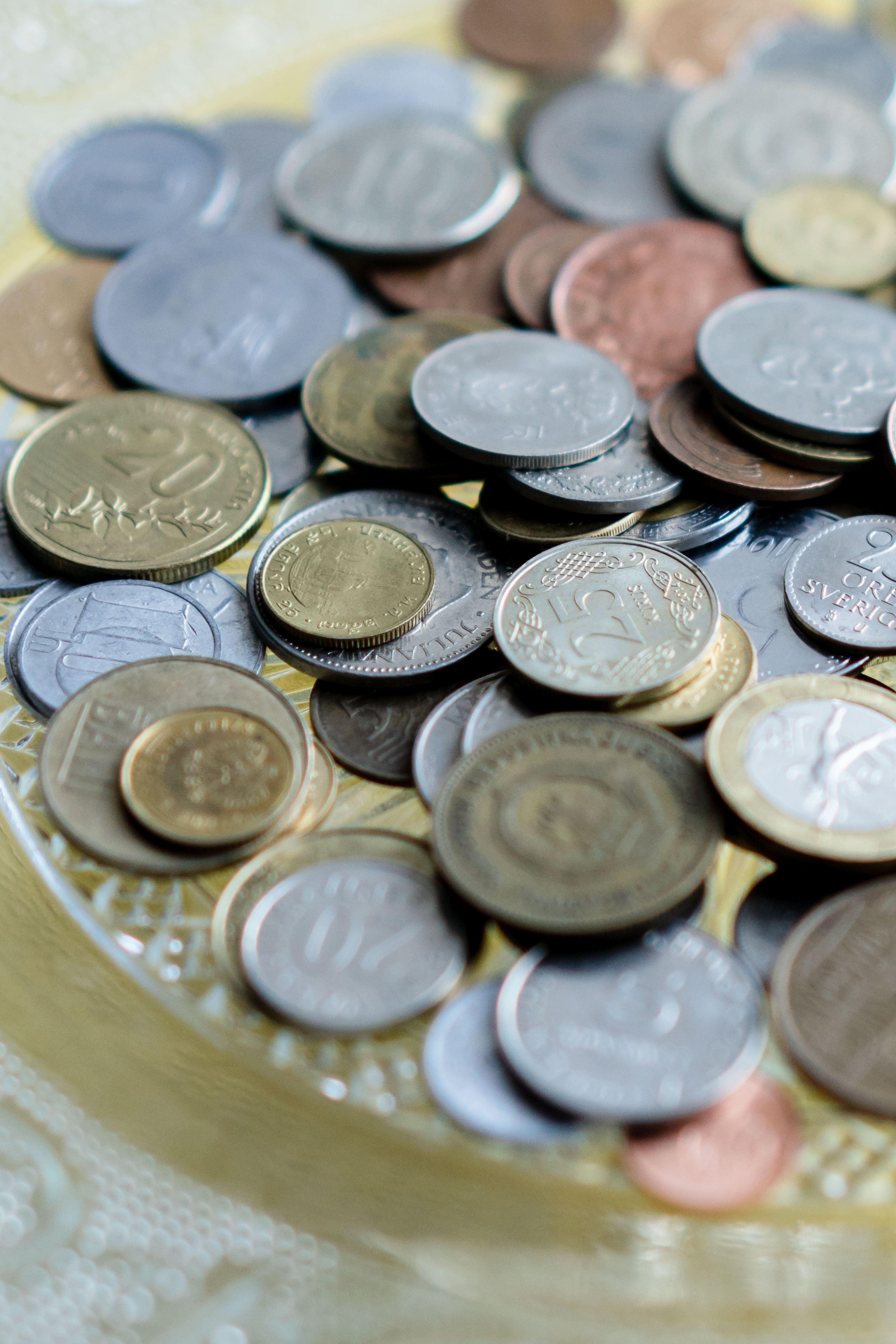 Silver Round Coins on Gray Surface · Free Stock Photo