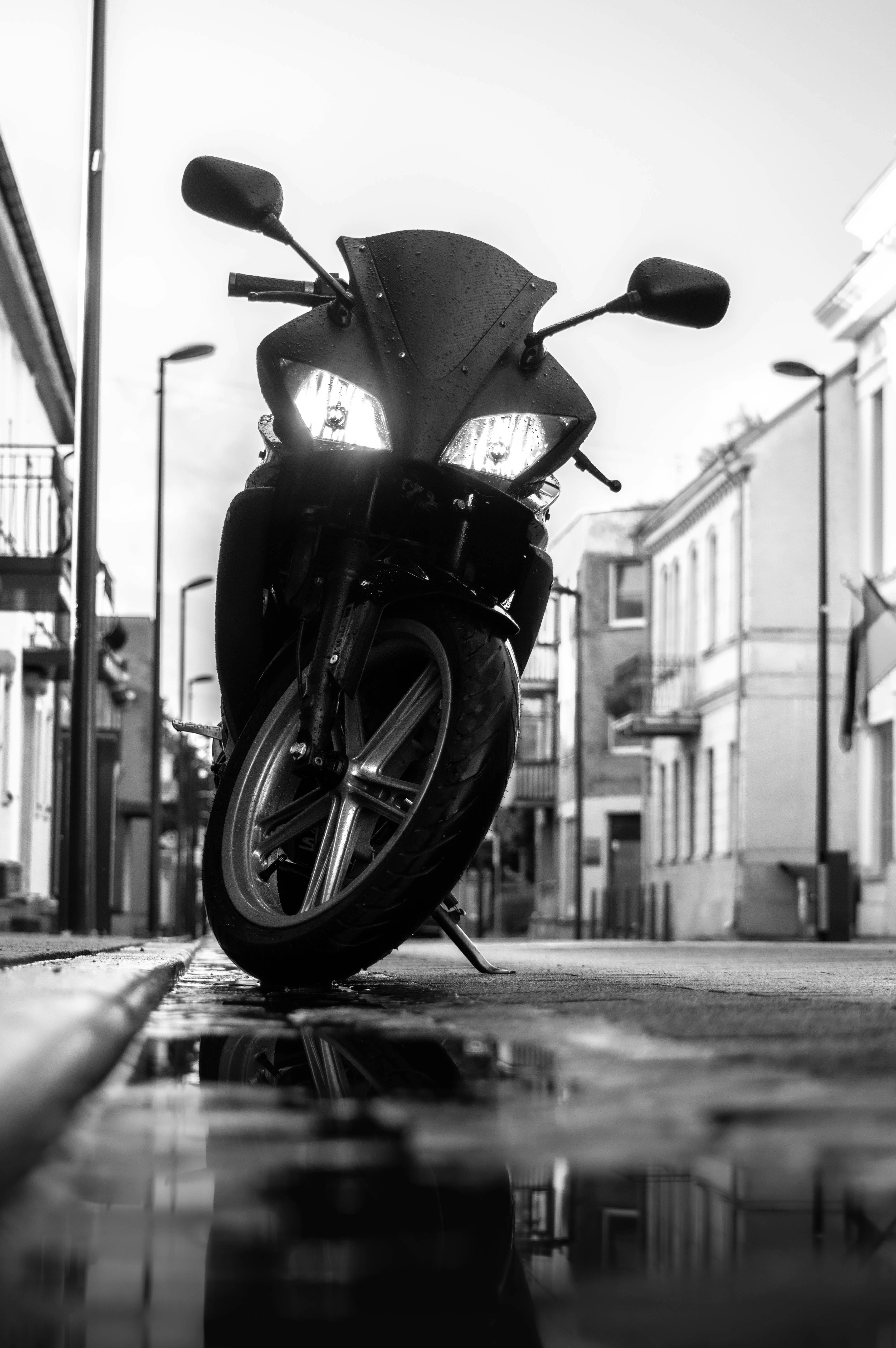 Grayscale Photo of a Damaged Motorcycle · Free Stock Photo