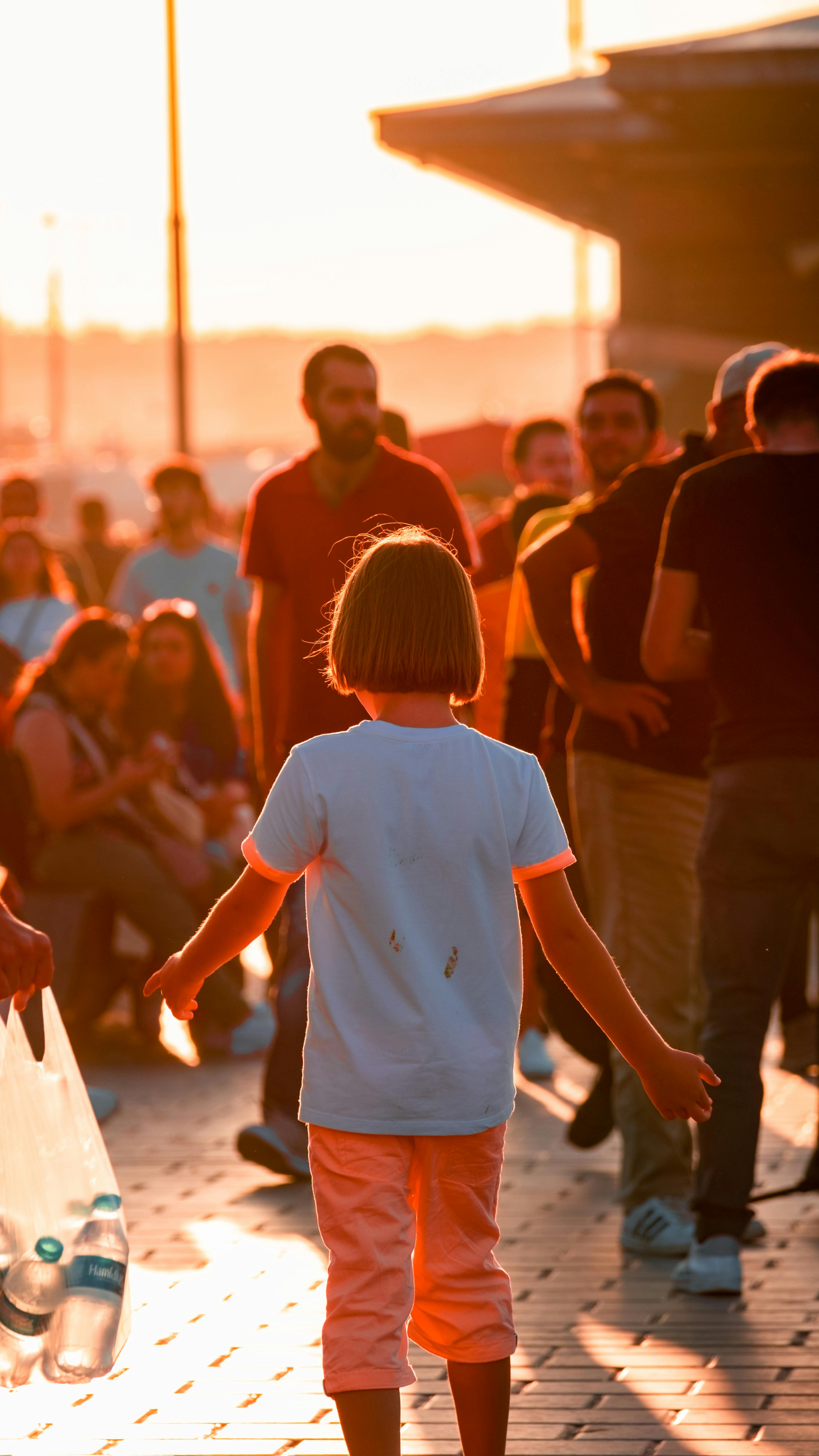 Child Standing in Crowd · Free Stock Photo